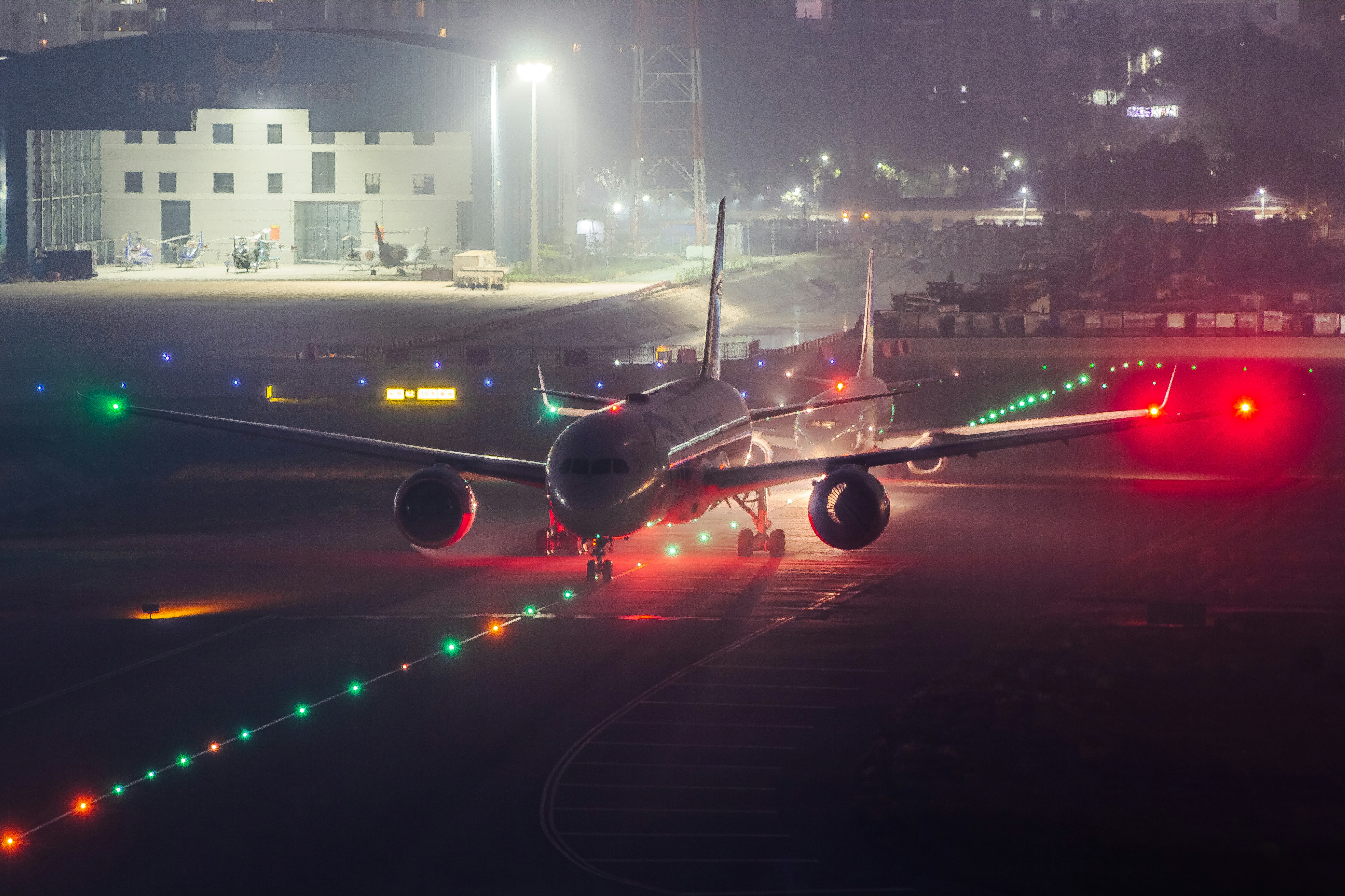 Midnight Taxi: Neon-Lit Jet on a Quiet Runway