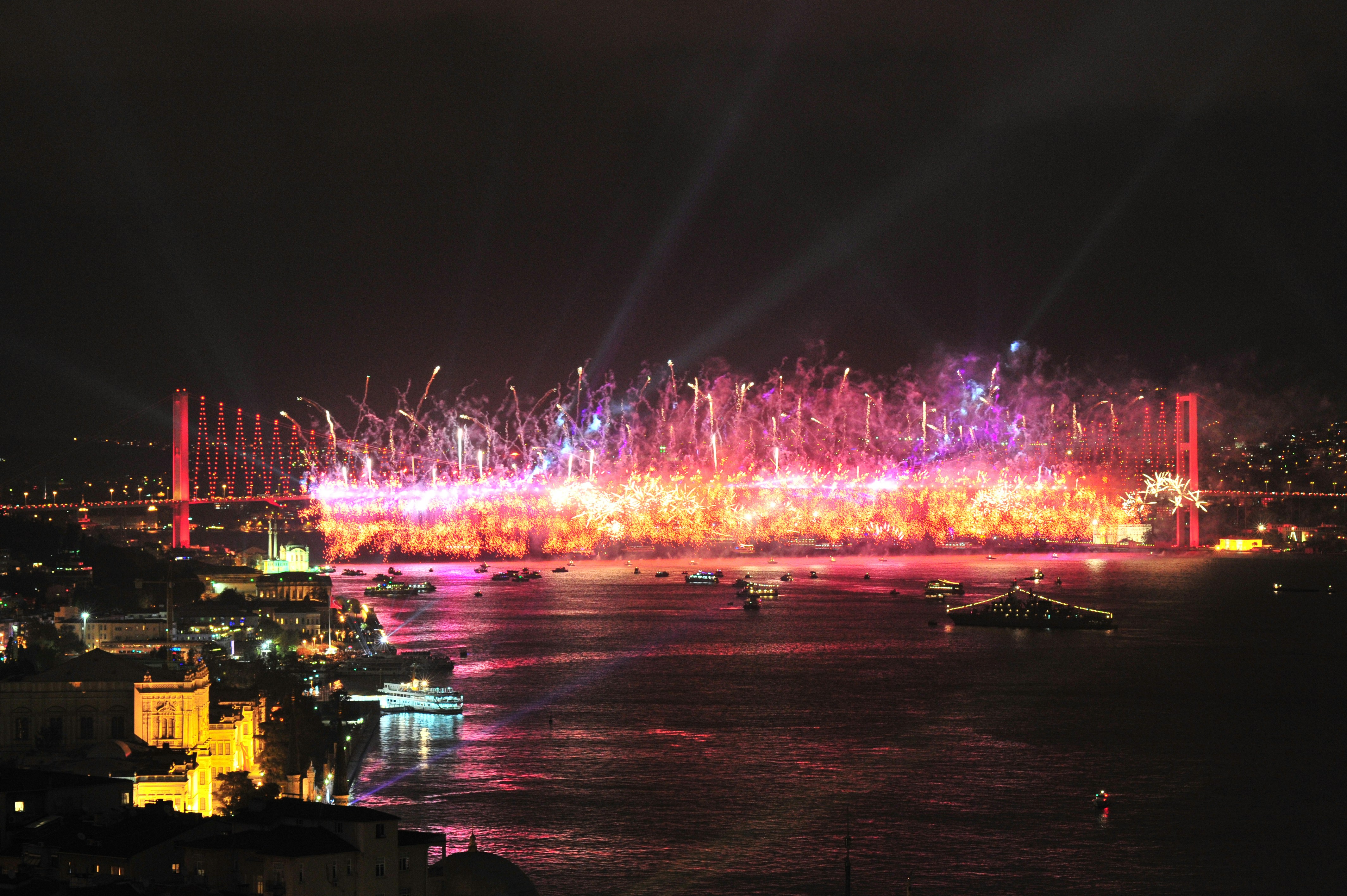 A large fireworks display over a city at night photo – Free City Image ...