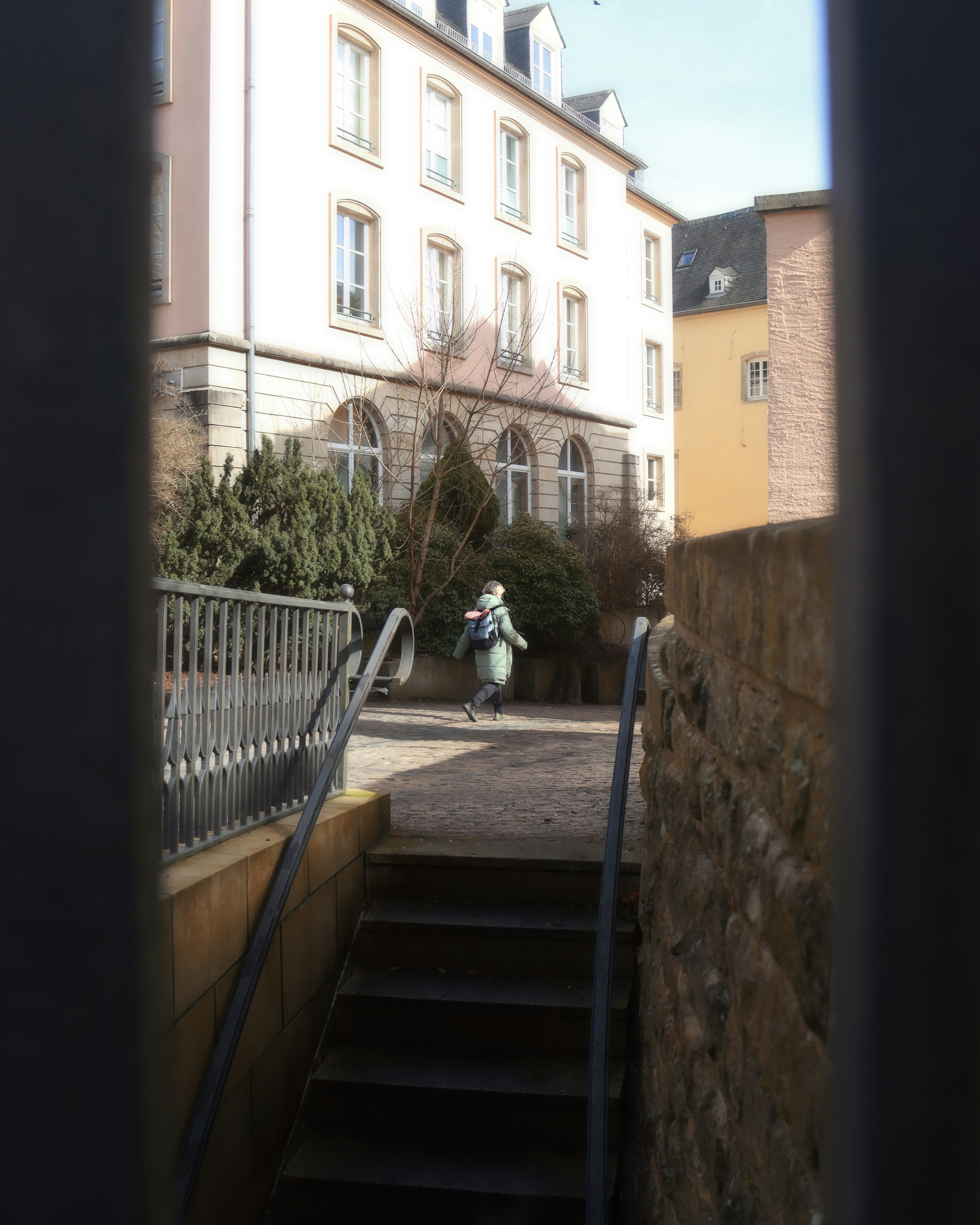 A person walking down a set of stairs photo – Free Portrait Image on ...