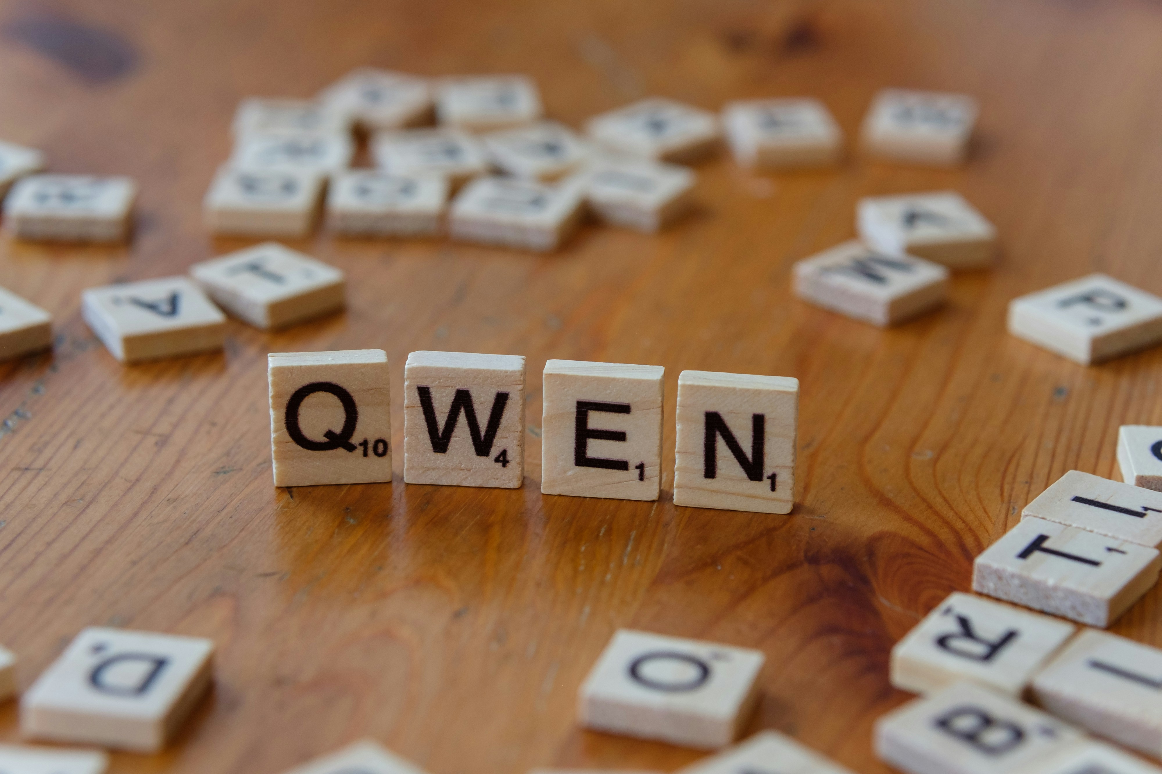 A wooden table topped with scrabble tiles spelling the word queen photo – Free Number Image on ...
