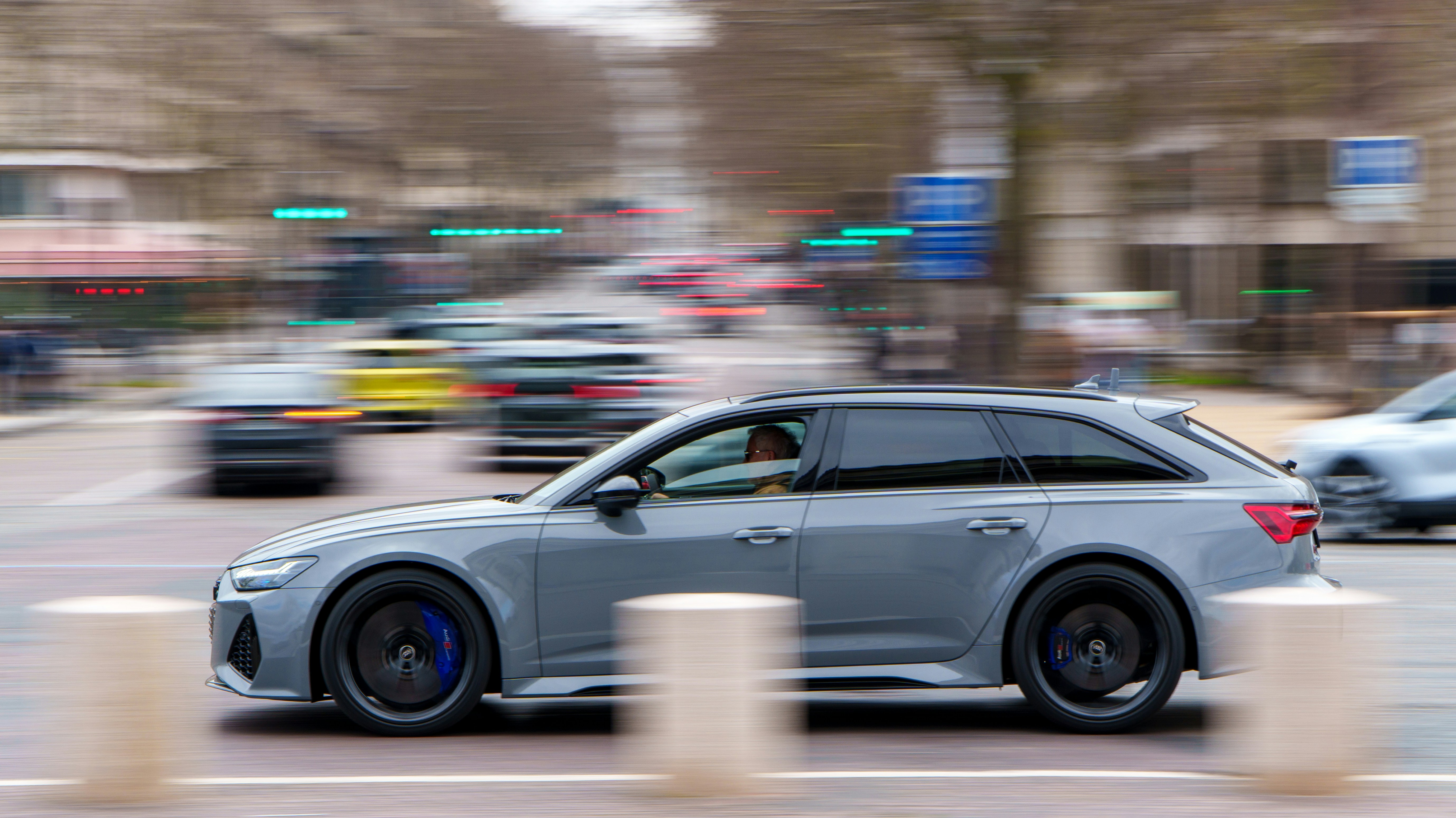 Urban Velocity: A Silver Car in Motion