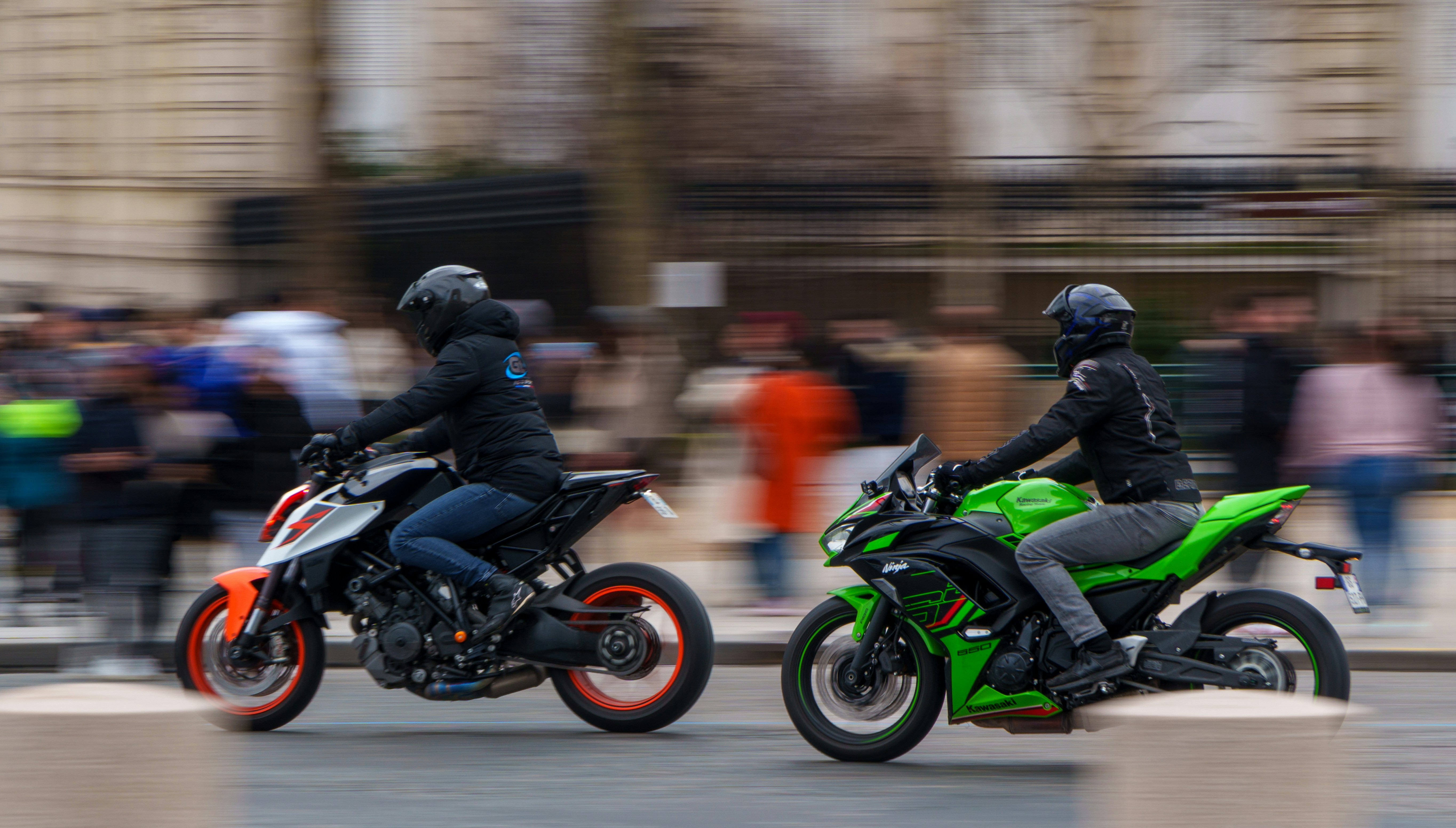 Two people riding motorcycles on a city street photo – Free Paris Image ...