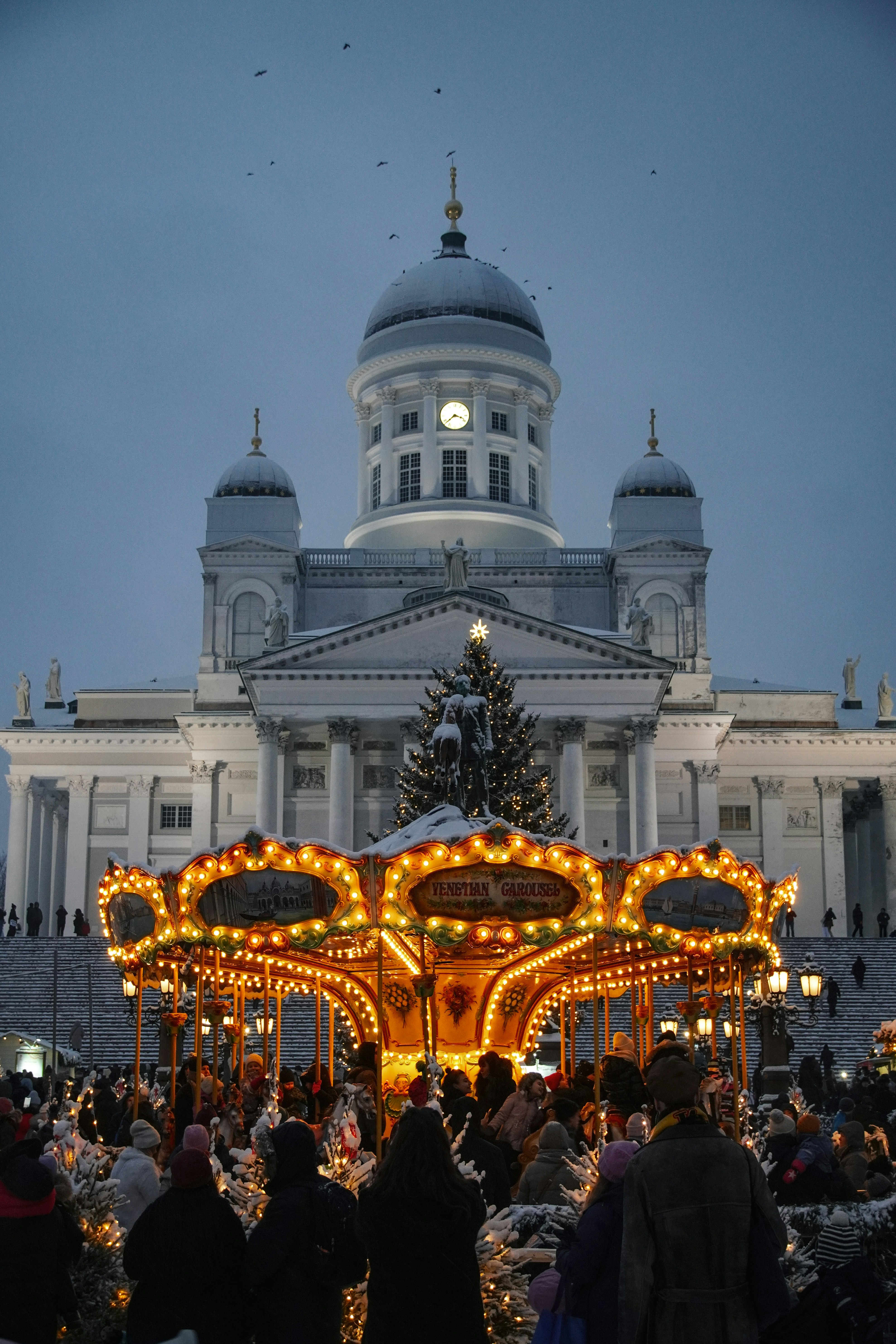 Golden Carousel and Christmas Tree Framed by a Grand Winter Cathedral