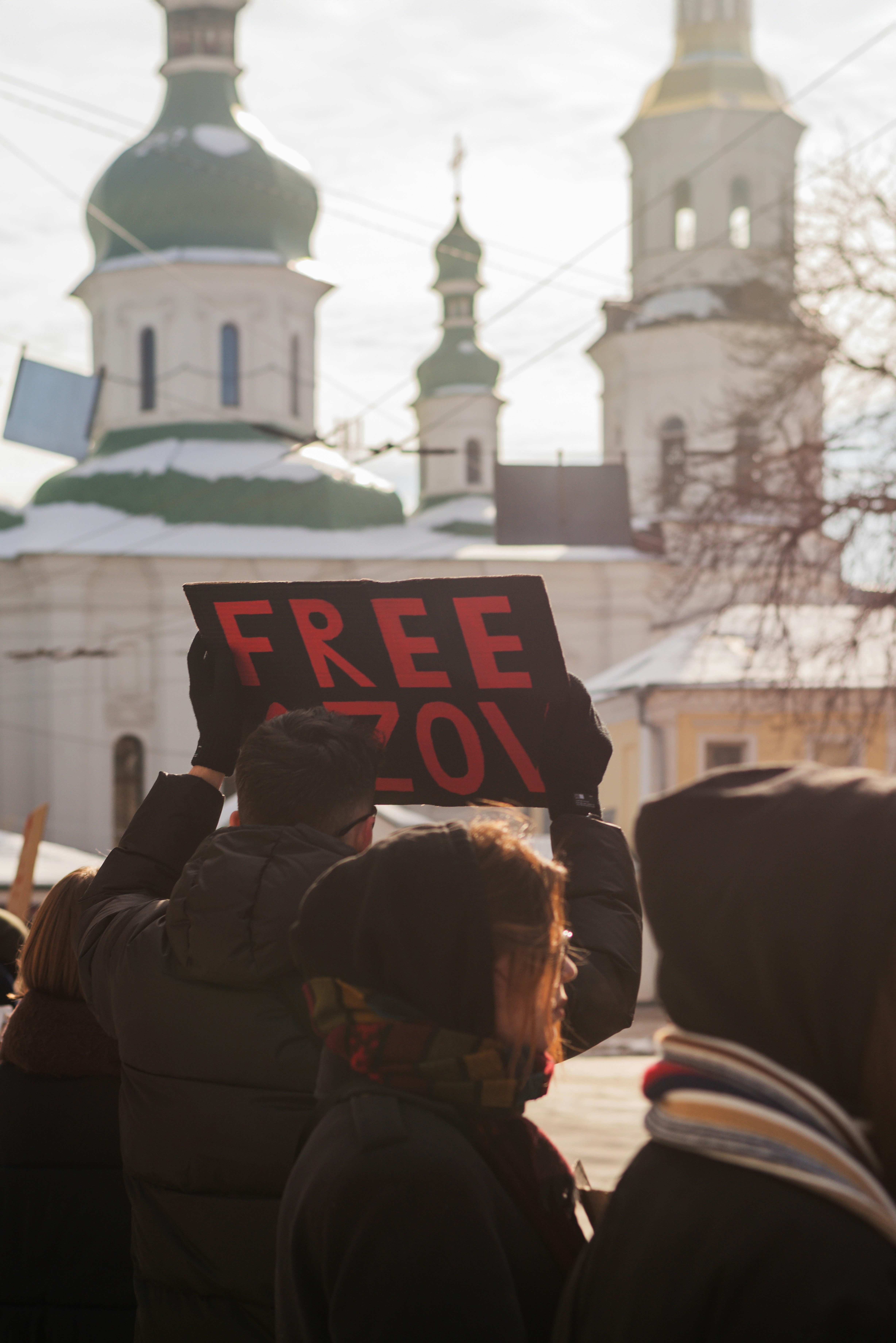 A group of people holding up a free sign photo – Free Woman Image on ...