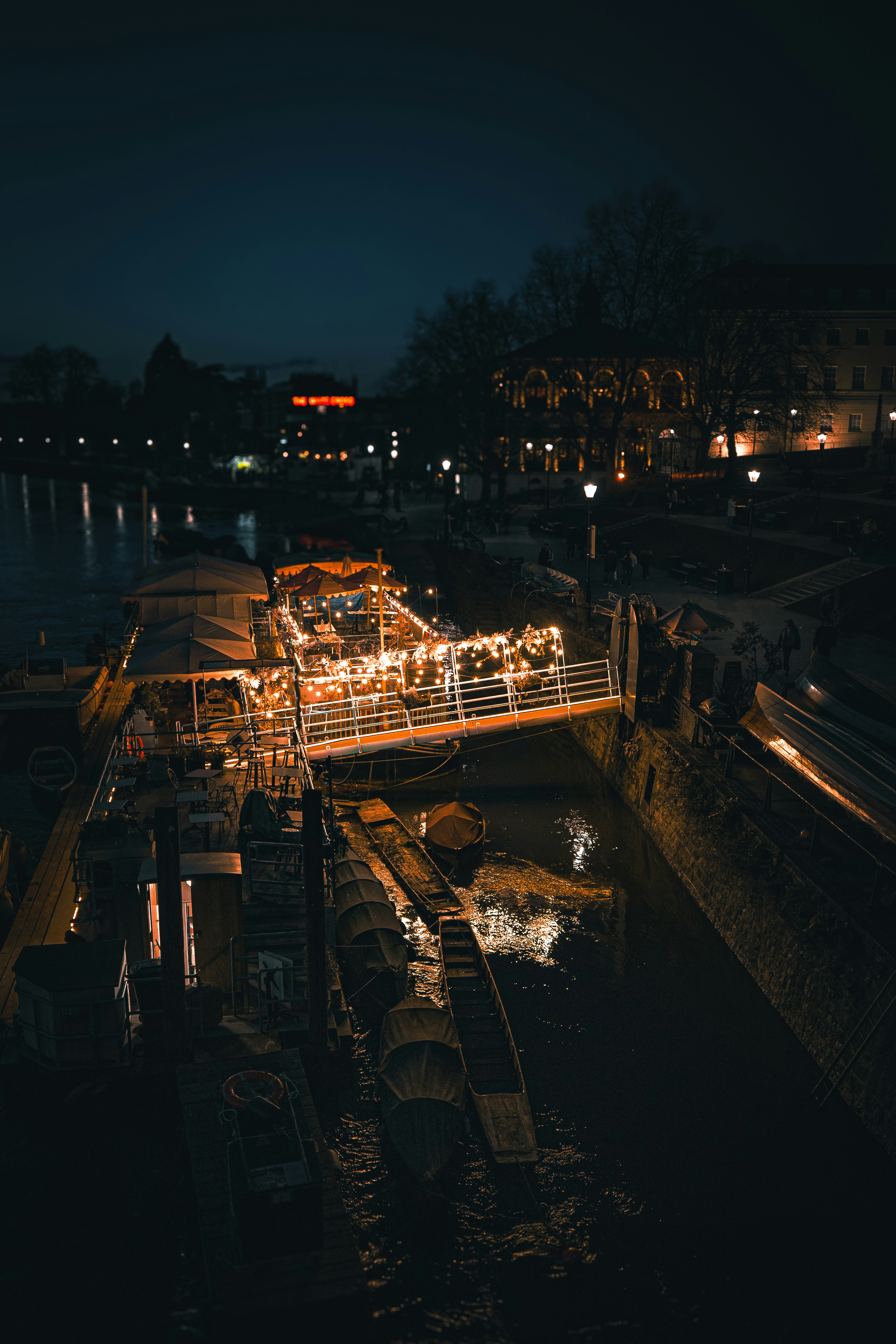 Canal Night Market: Lantern-lit Terrace Glows Over Quiet Waters