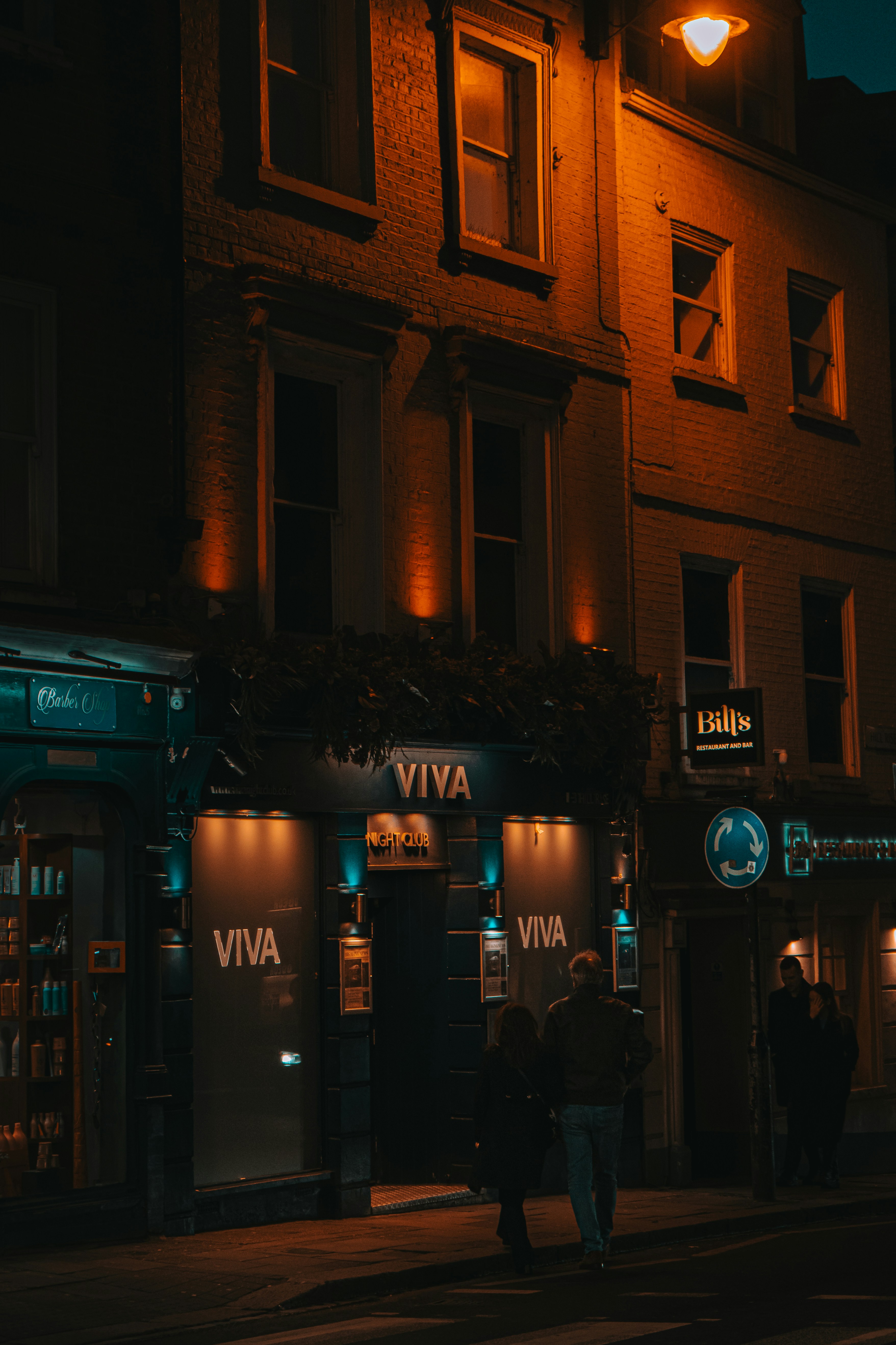 Neon Quiet: Nightlife Slips Through a Quiet Doorway