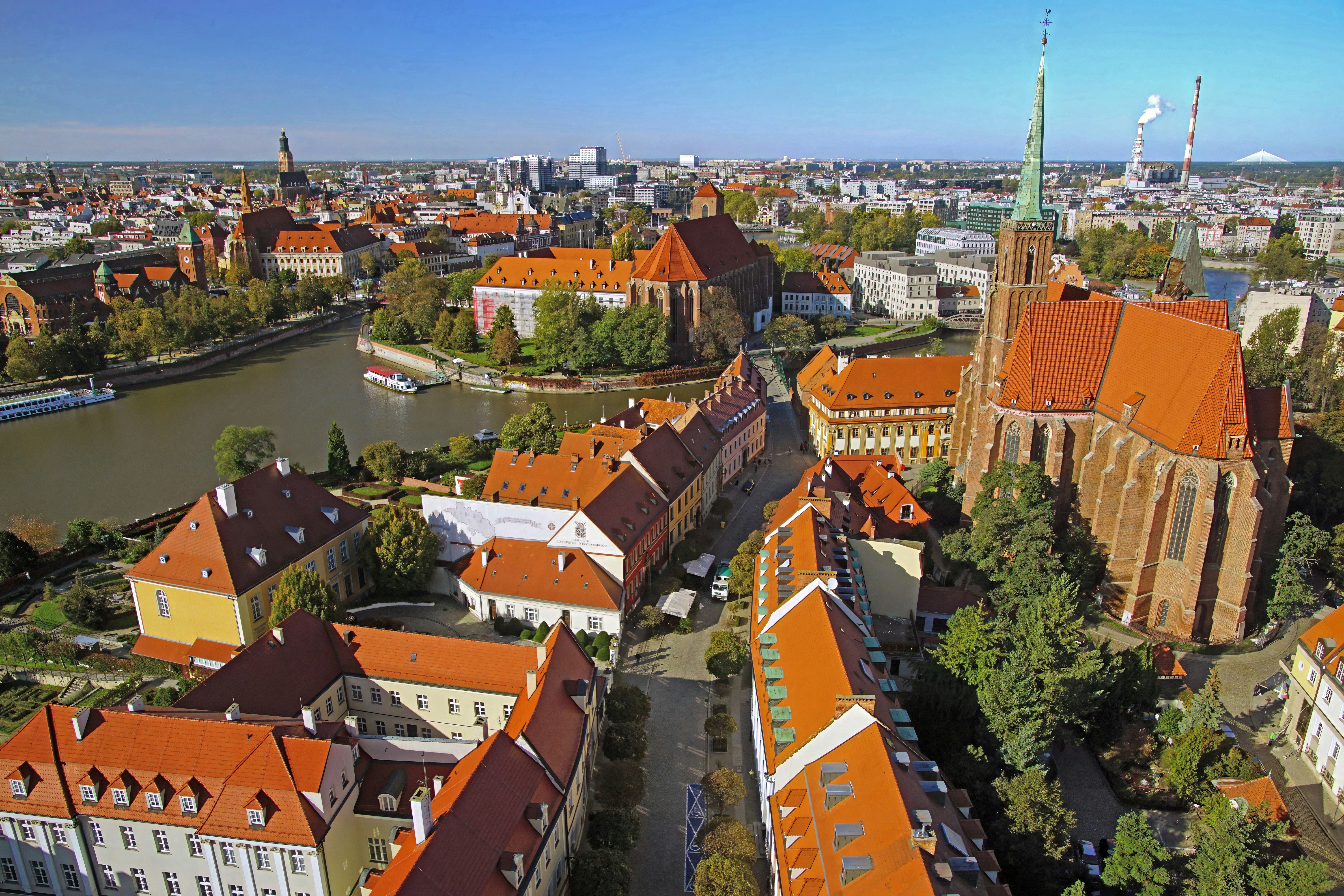 Wroclaw's vibrant red rooftops and Gothic architecture viewed from above on a clear day.