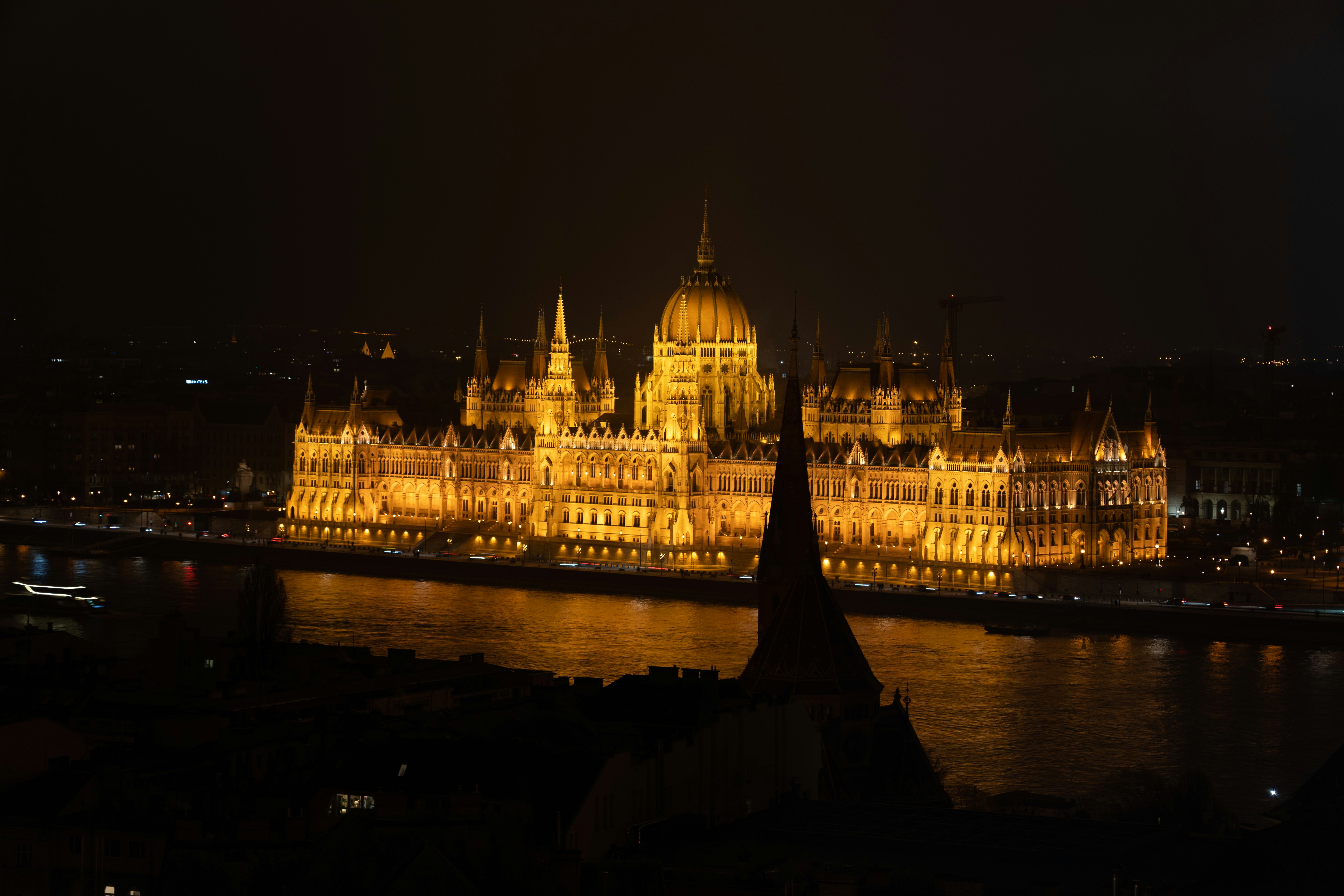 A night view of a large building with a clock tower photo – Free ...