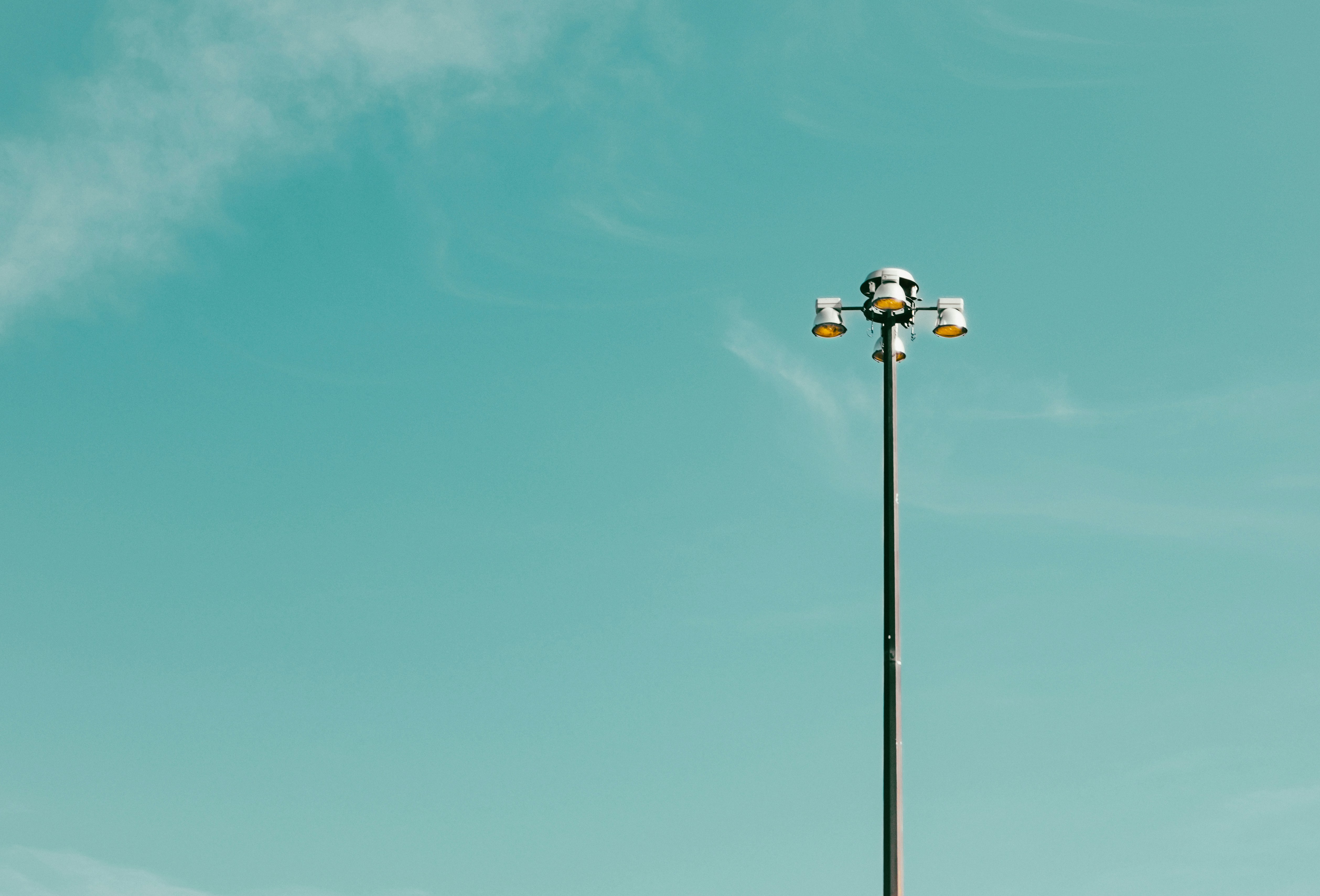 lamp post | A street light sitting on the side of a road