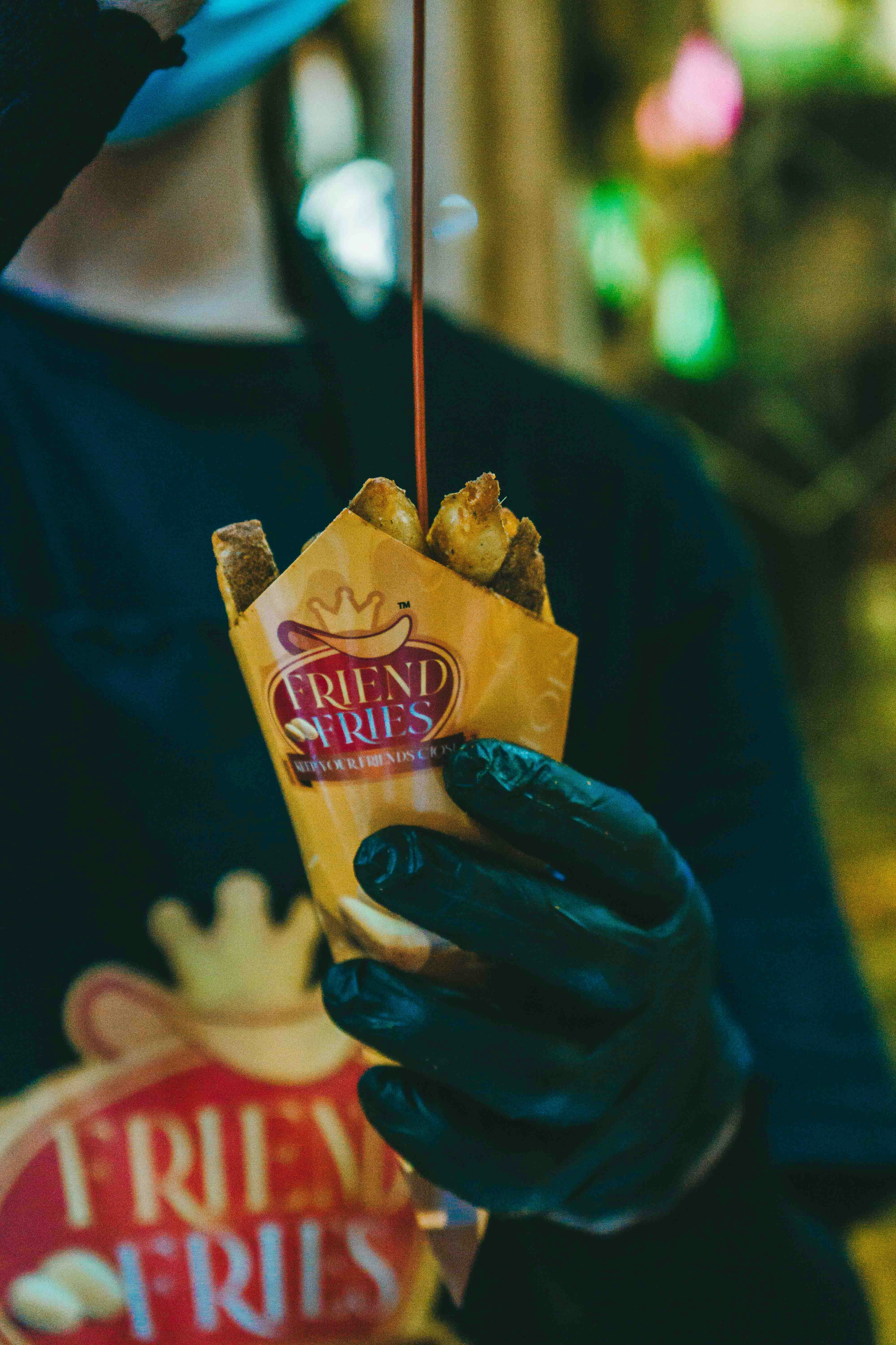 Gloved Hands, Crunchy Snack, and a Drizzle of Syrup
