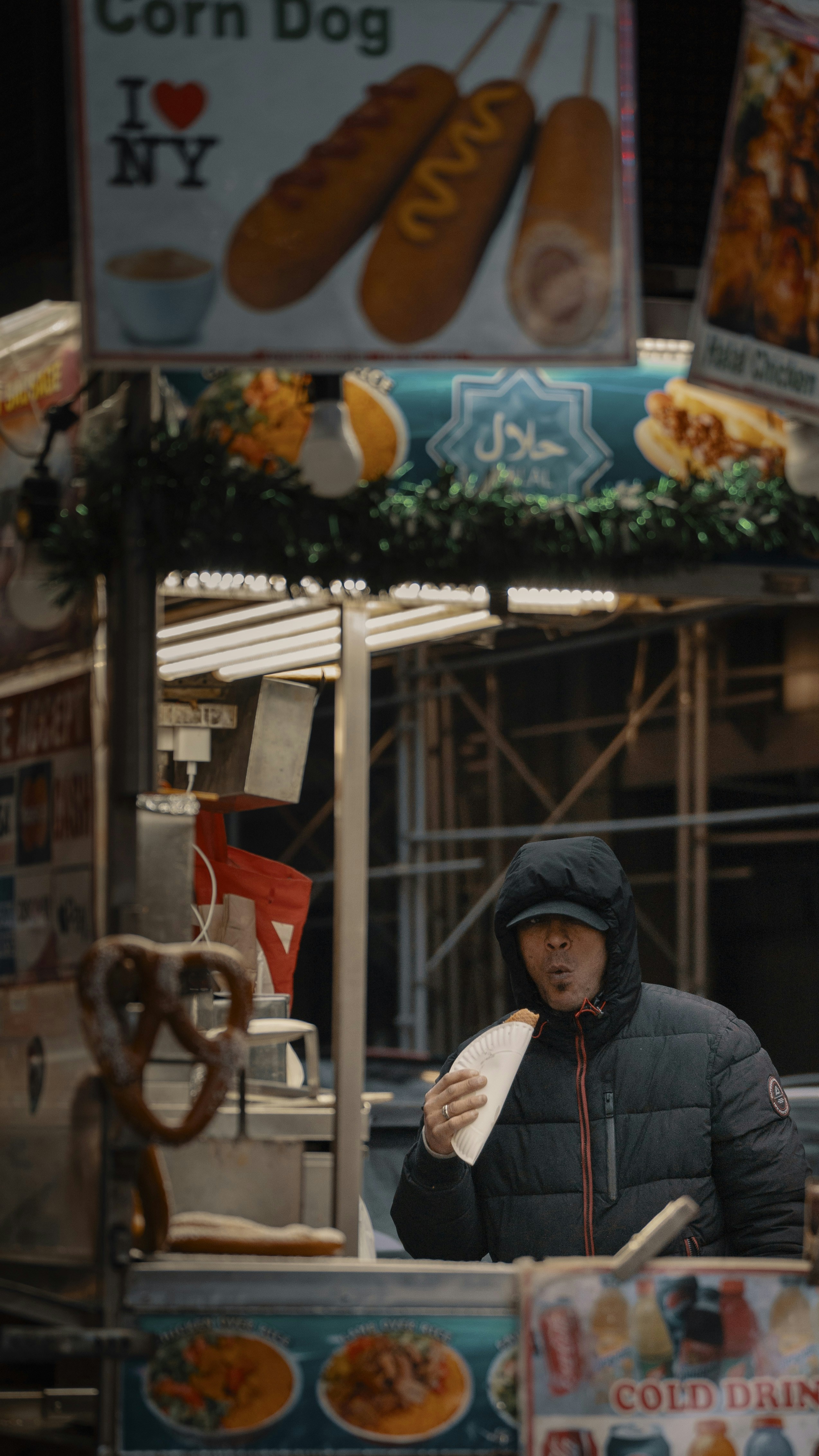 Midnight Snack Break: A Hooded Figure Sips Salt in the Street Food Stall