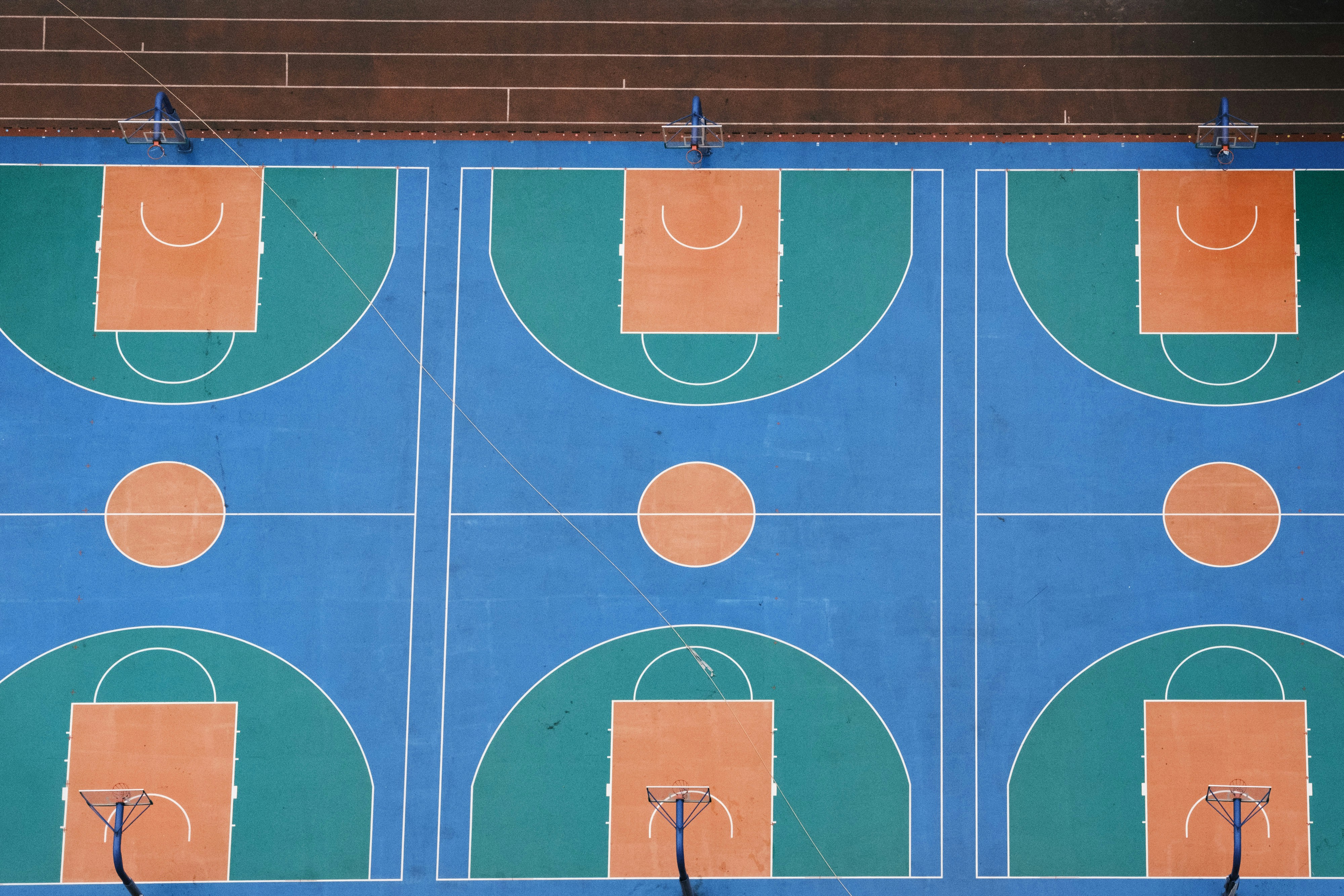 A basketball court with several basketballs on it photo – Free ...