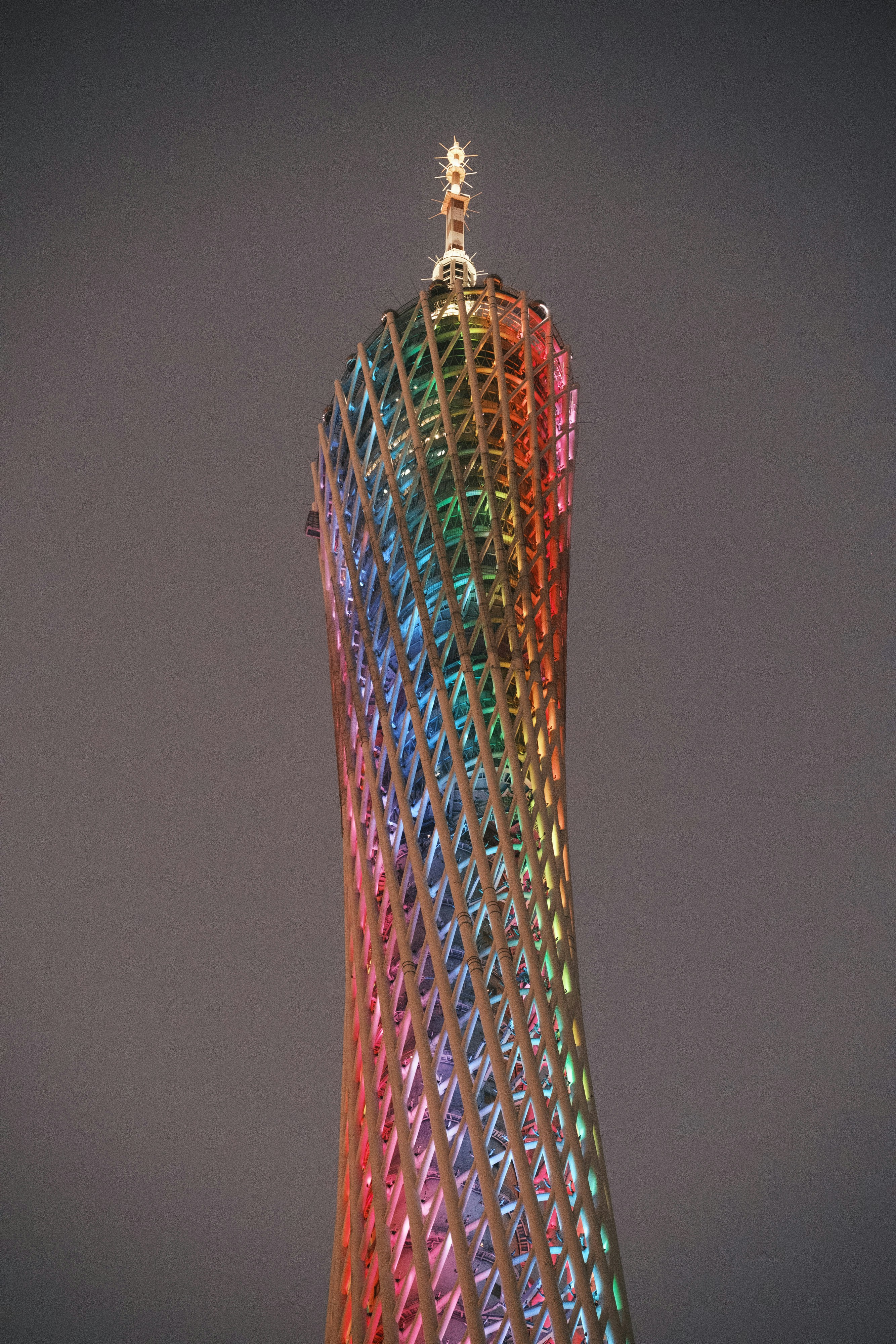 Spectrum Spiral: Rainbow-Tinted Tower Reaching the Night Sky