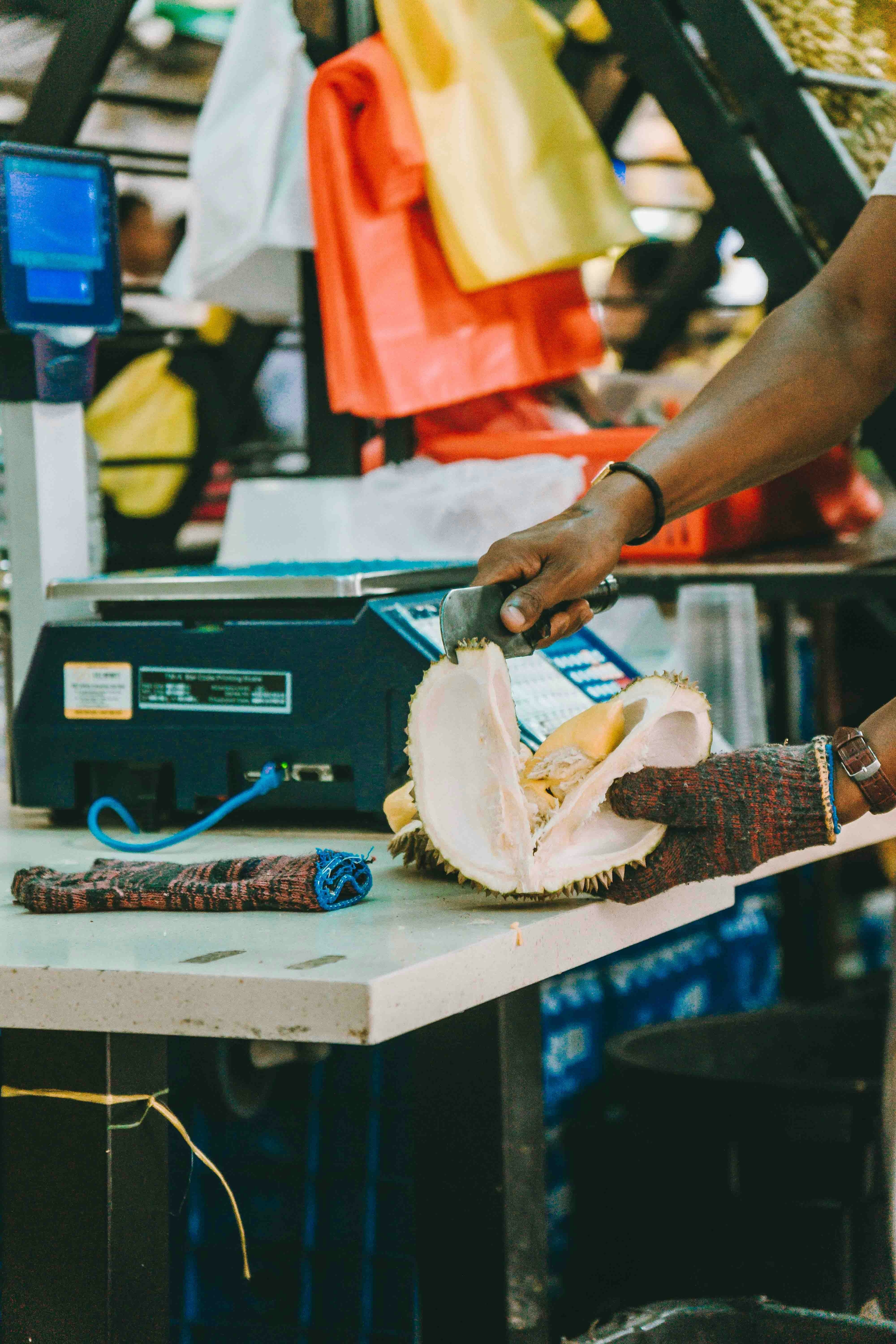 In-Hand Jackfruit Unveiled: A Busy Market Slice