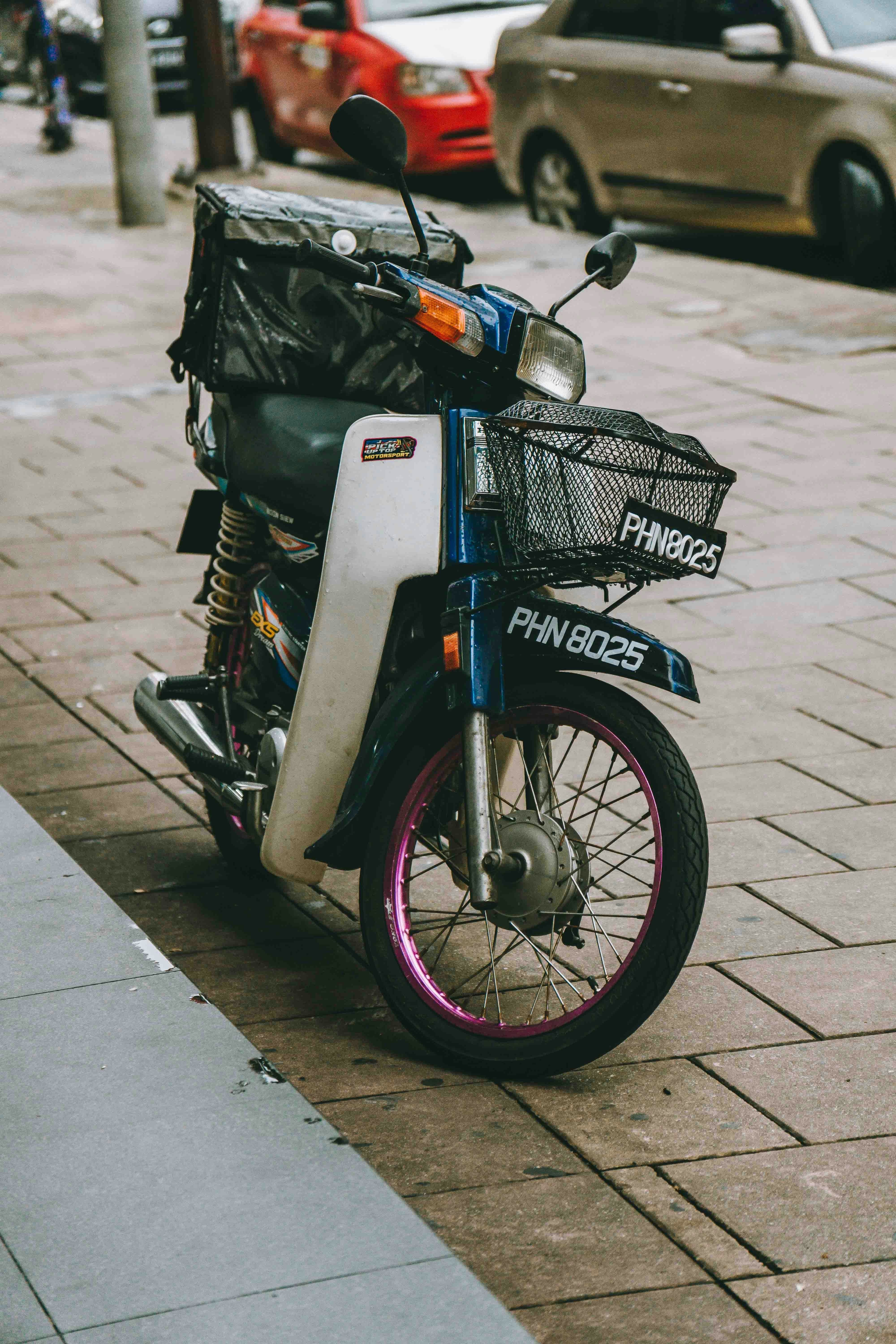 Urban Mail-Delivery Ride: A Street Scooter with a Bright Ringed Rim