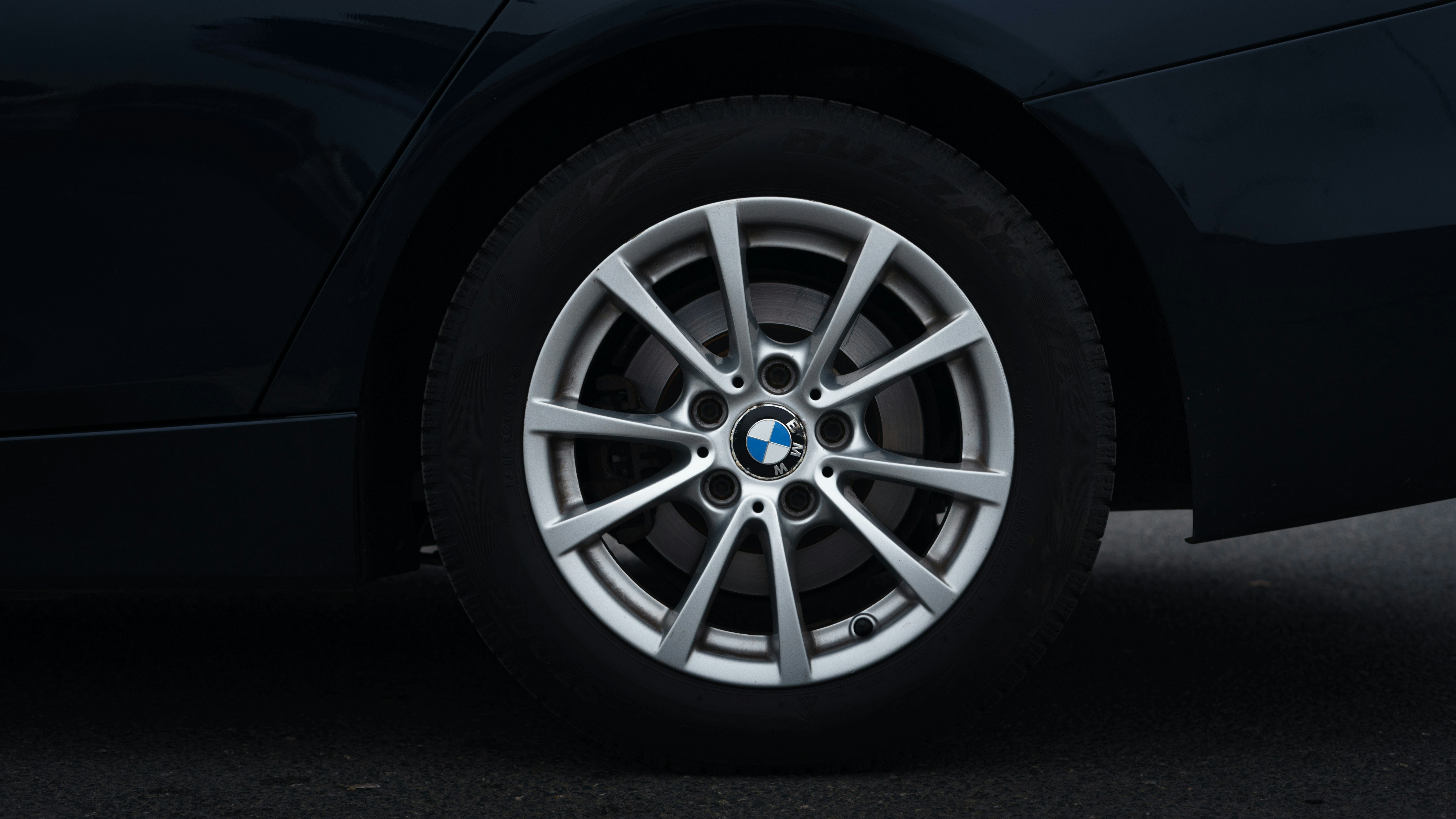 A close up of a car wheel on a street photo – Free Alloy wheel Image on ...