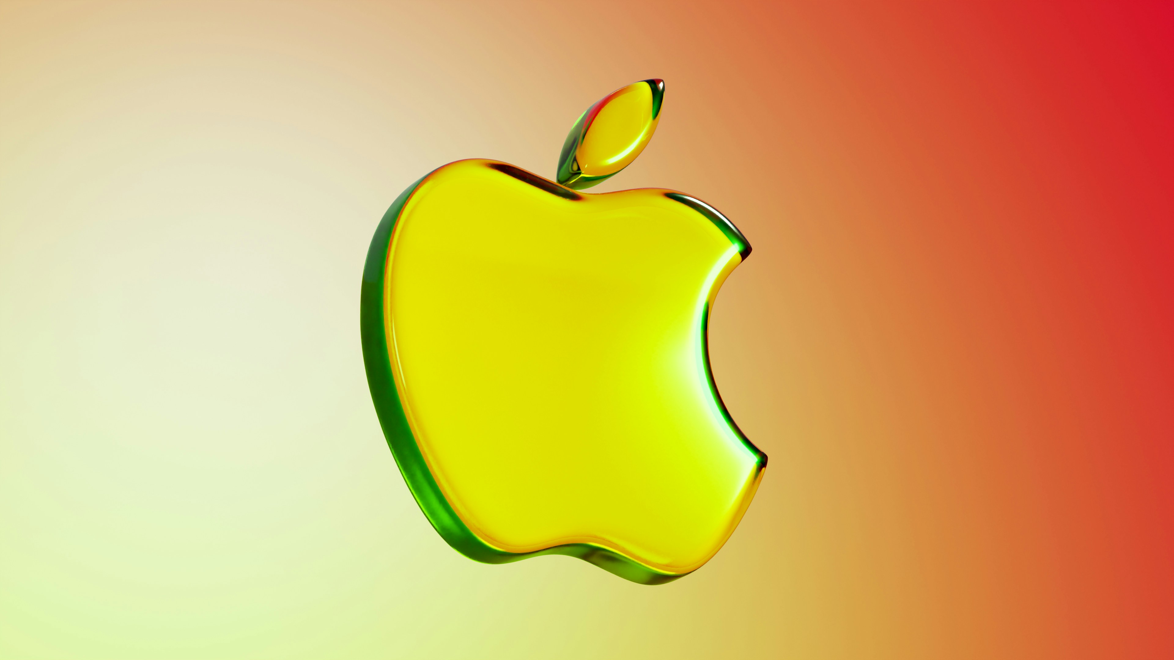 A yellow apple logo on a red and yellow background photo – Free Apple ...
