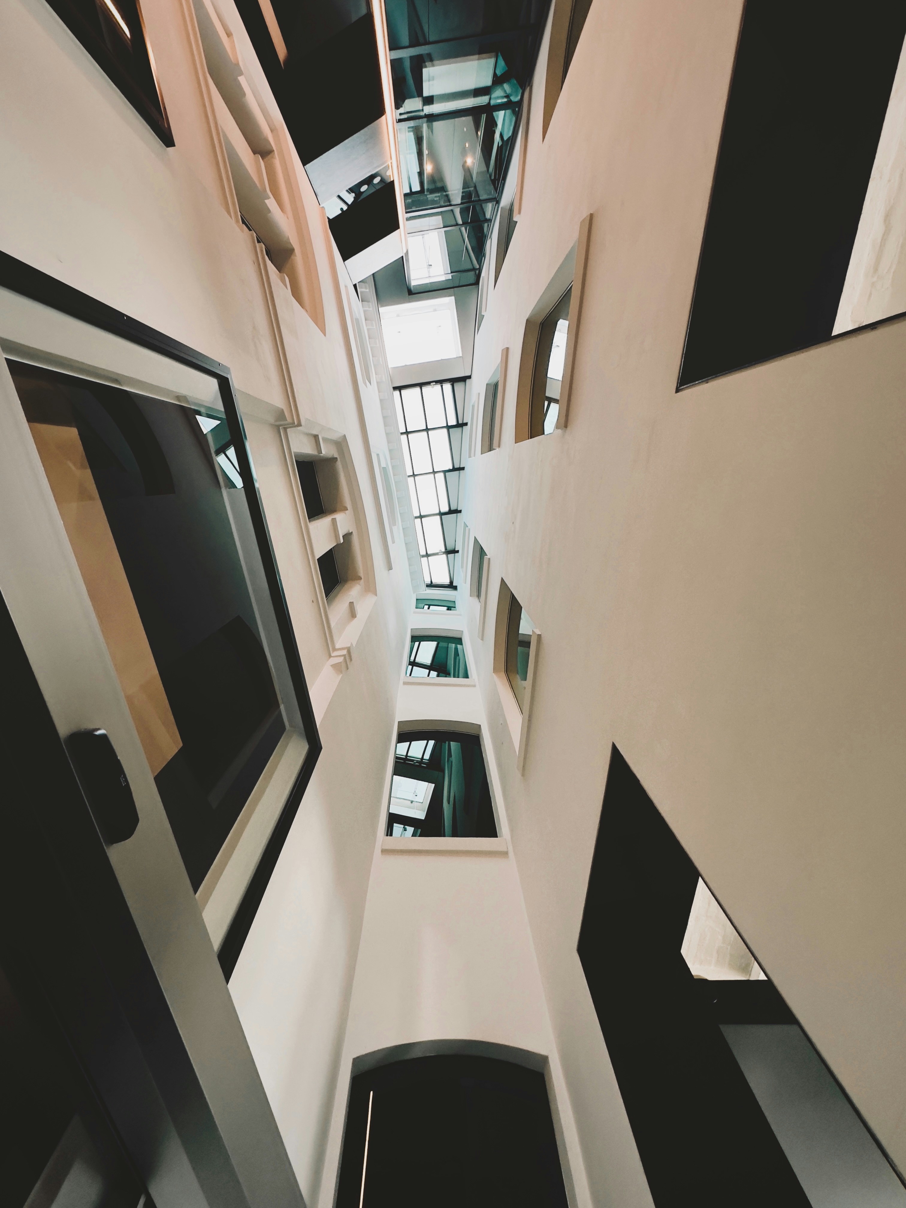 Looking up at the ceiling of a narrow building photo – Free Indoors ...
