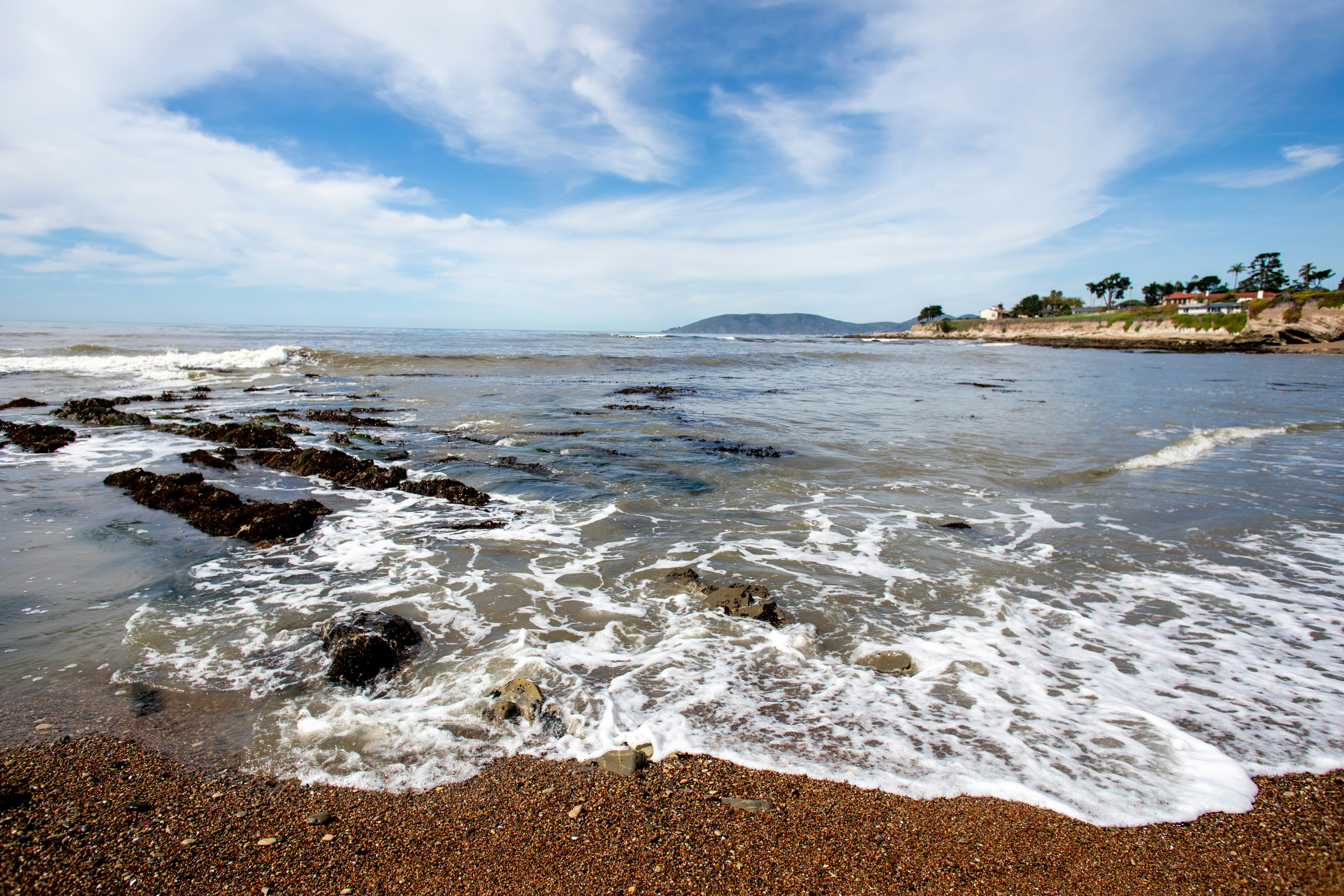 A view of the ocean from a rocky shore