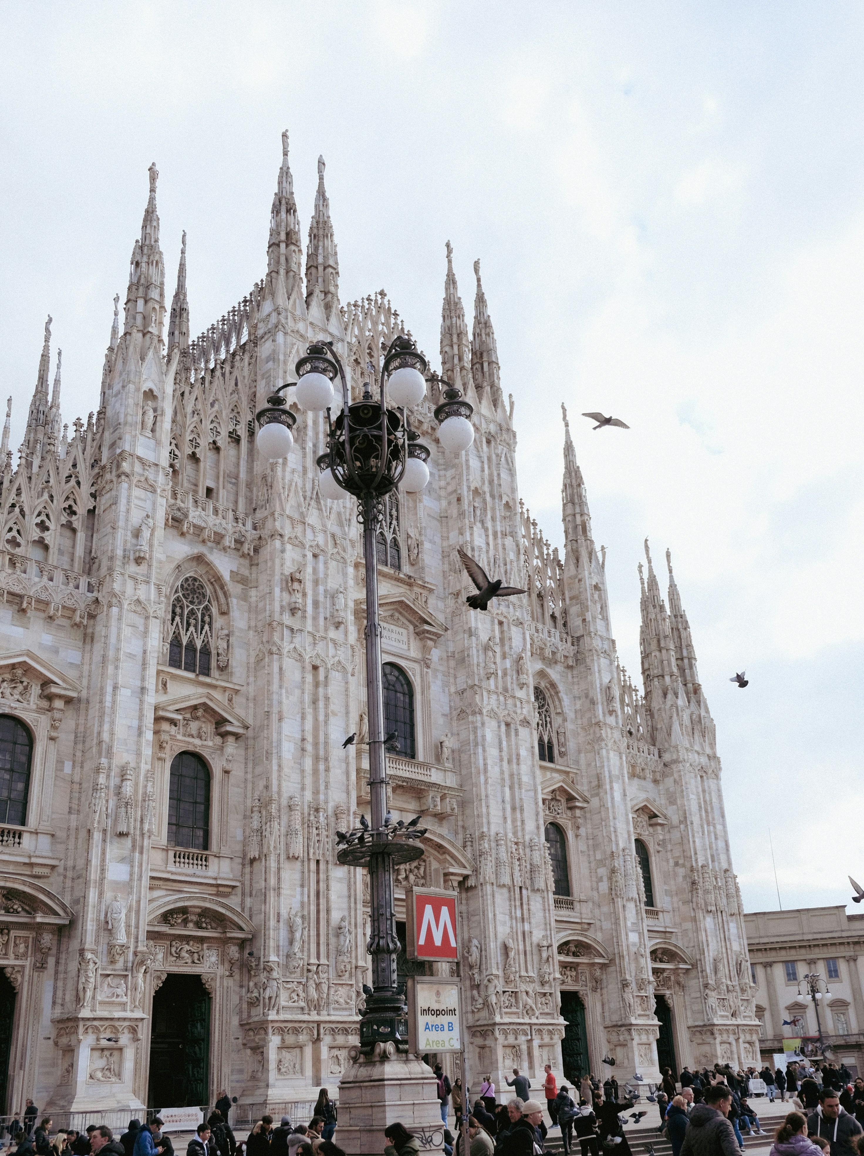 Gothic Lanterns at Milan's Duomo: A Street-Level Moment