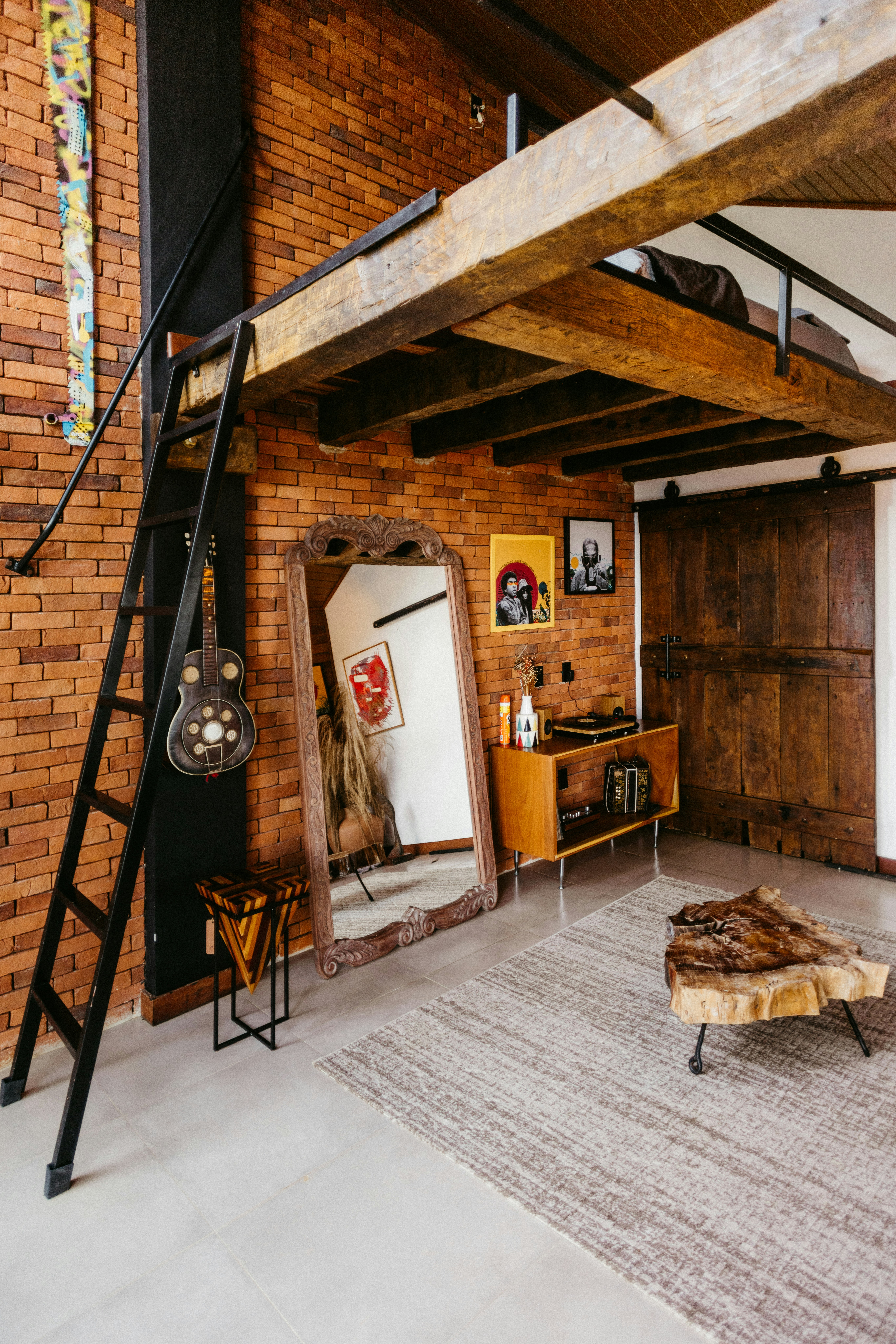 Loft Echo: Brick, Guitars, and a Framed Reflection