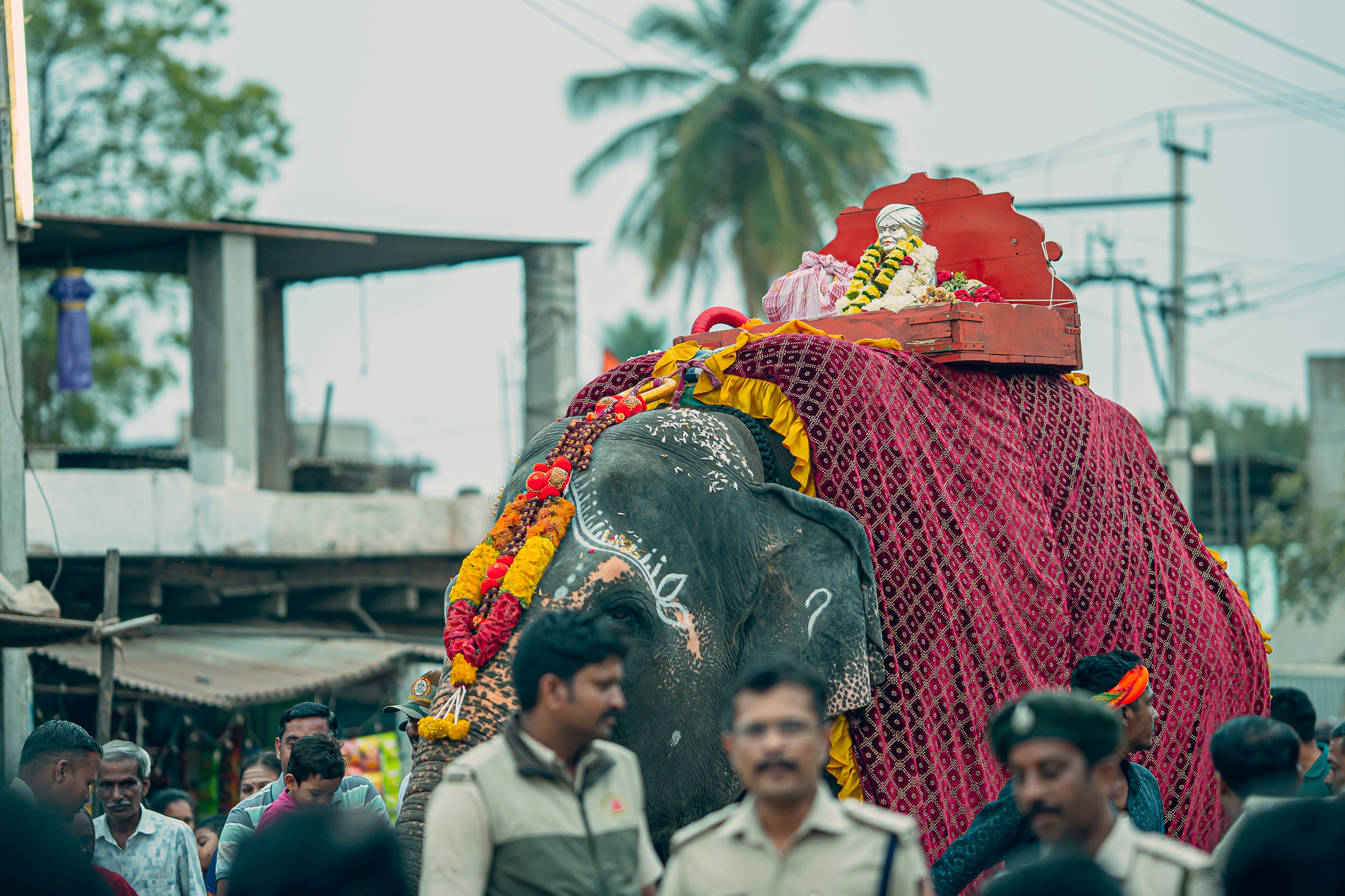 Garlanded Colossus in a City Parade