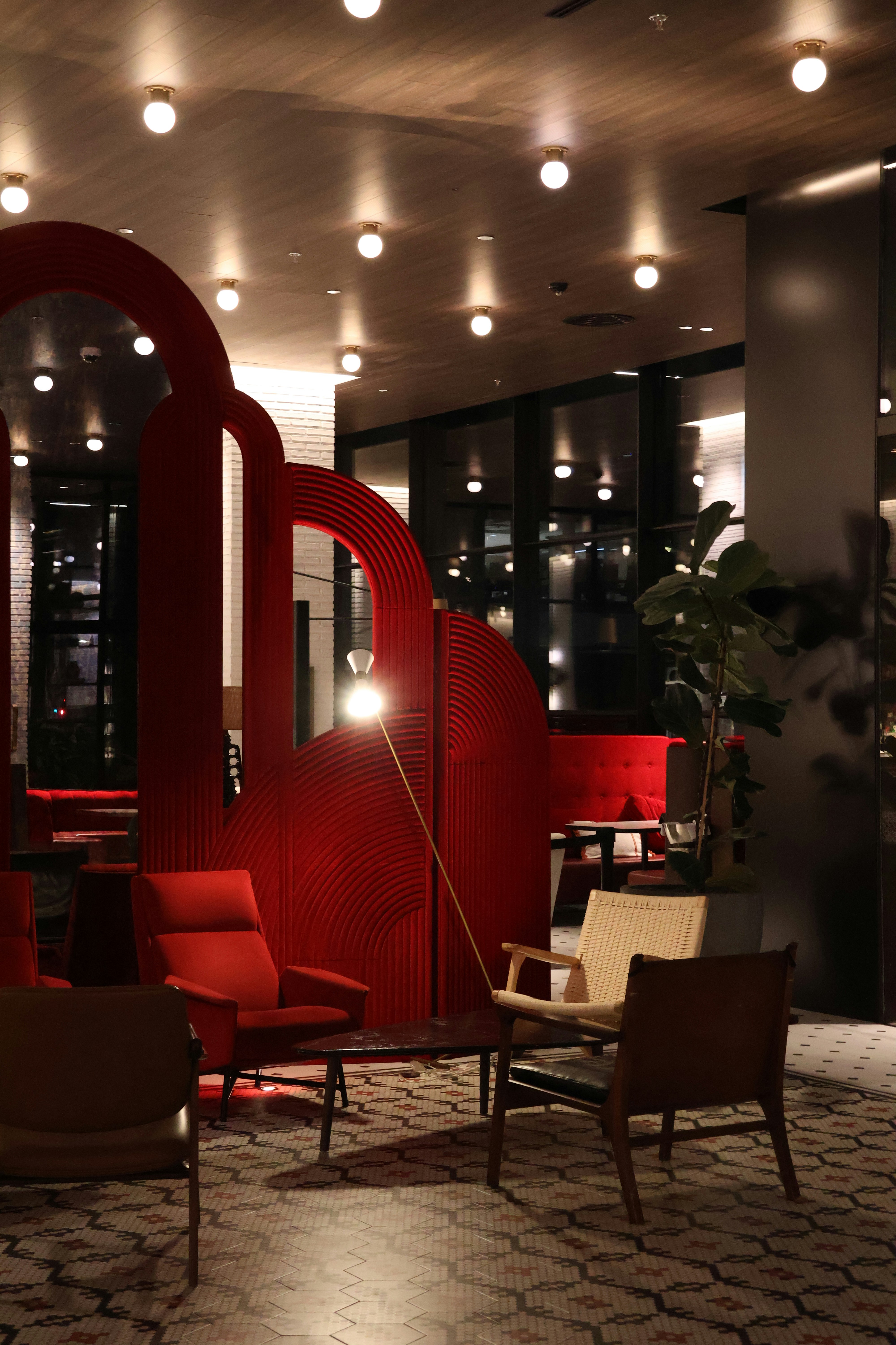 Red Arcades and Warm Light in a Modern Lounge