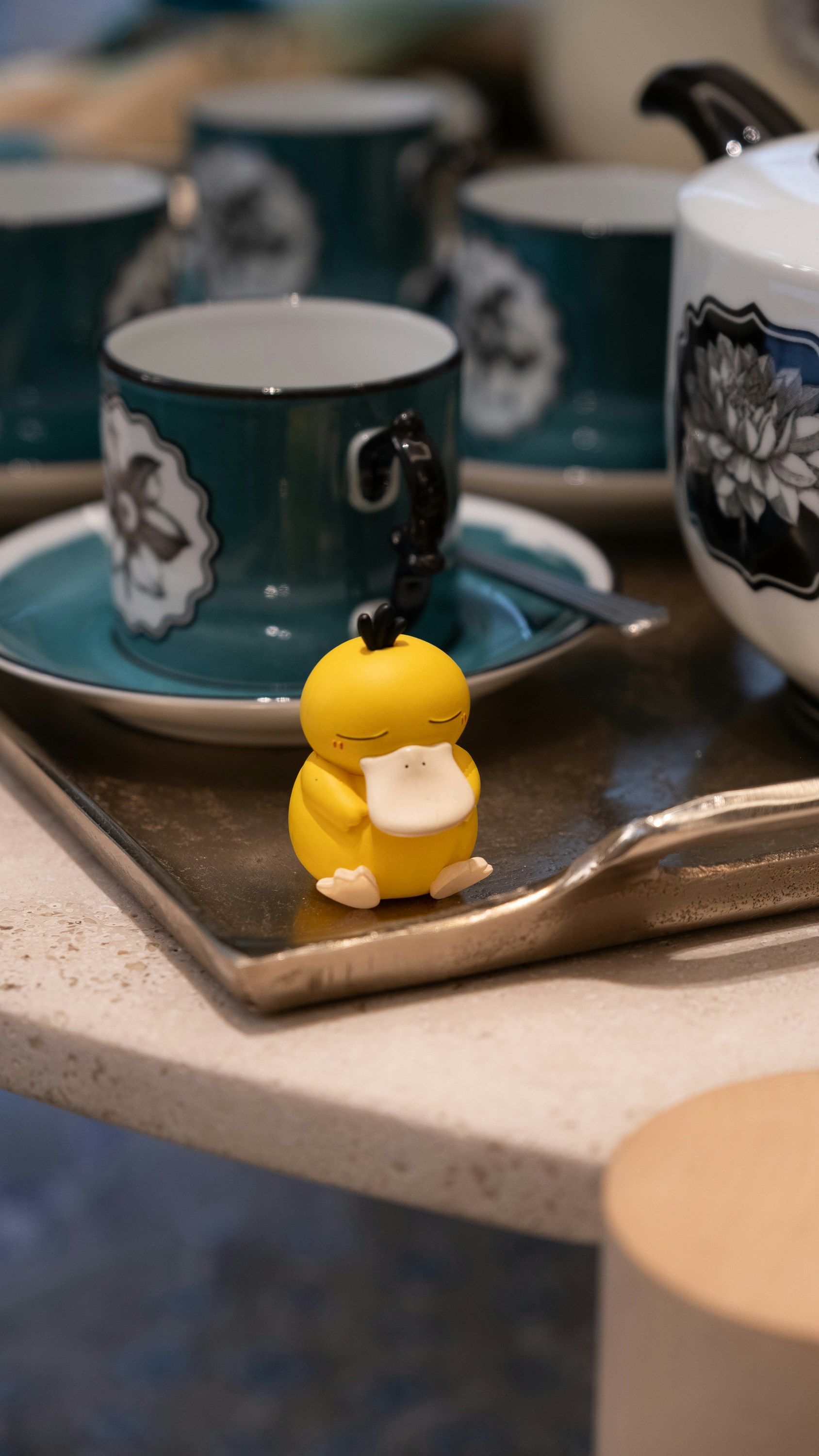 A tea set with a yellow rubber duck on a tray photo – Free Psyduck ...