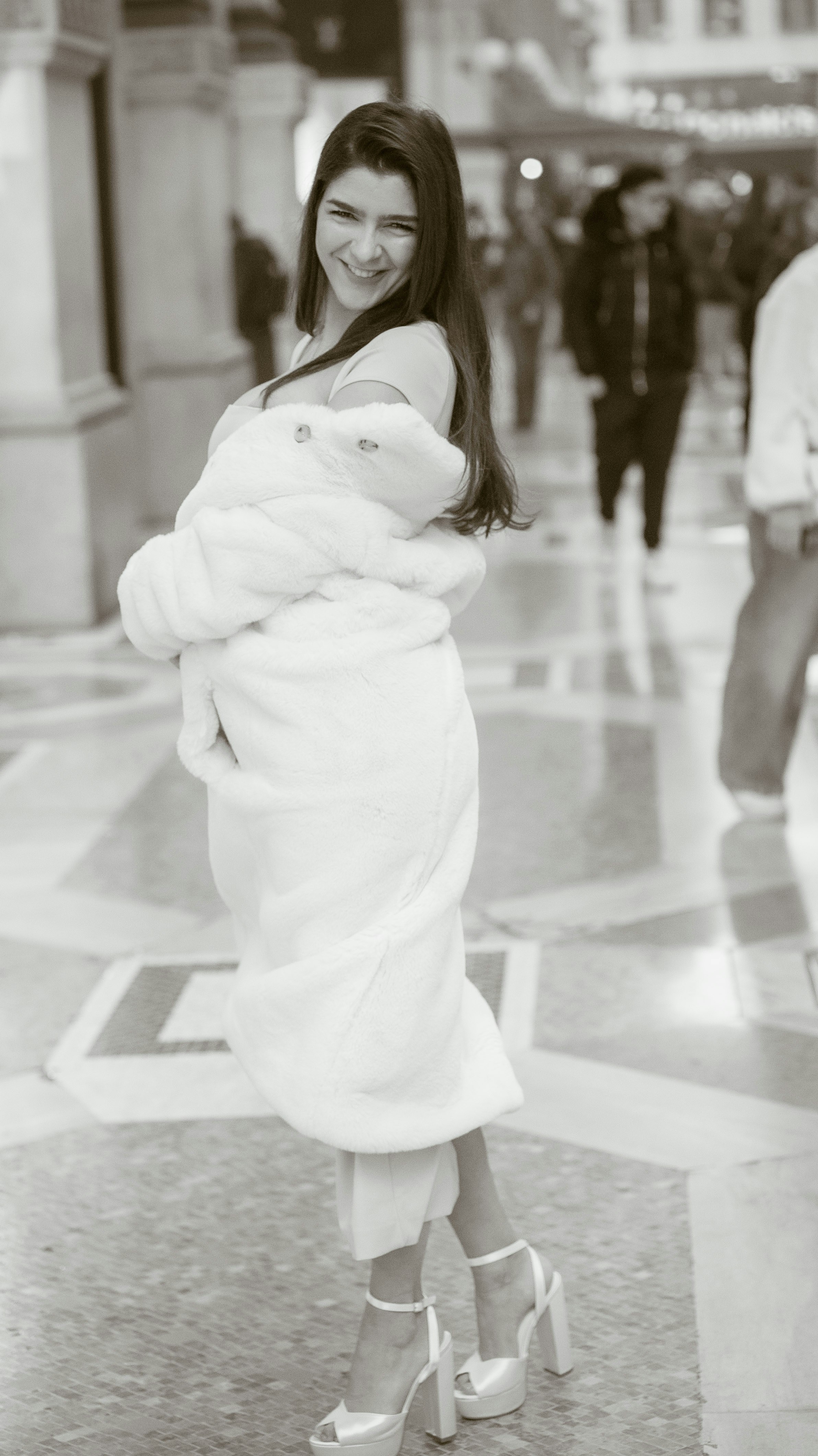 Quiet Smile in White: A Marble-Street Portrait in Sepia