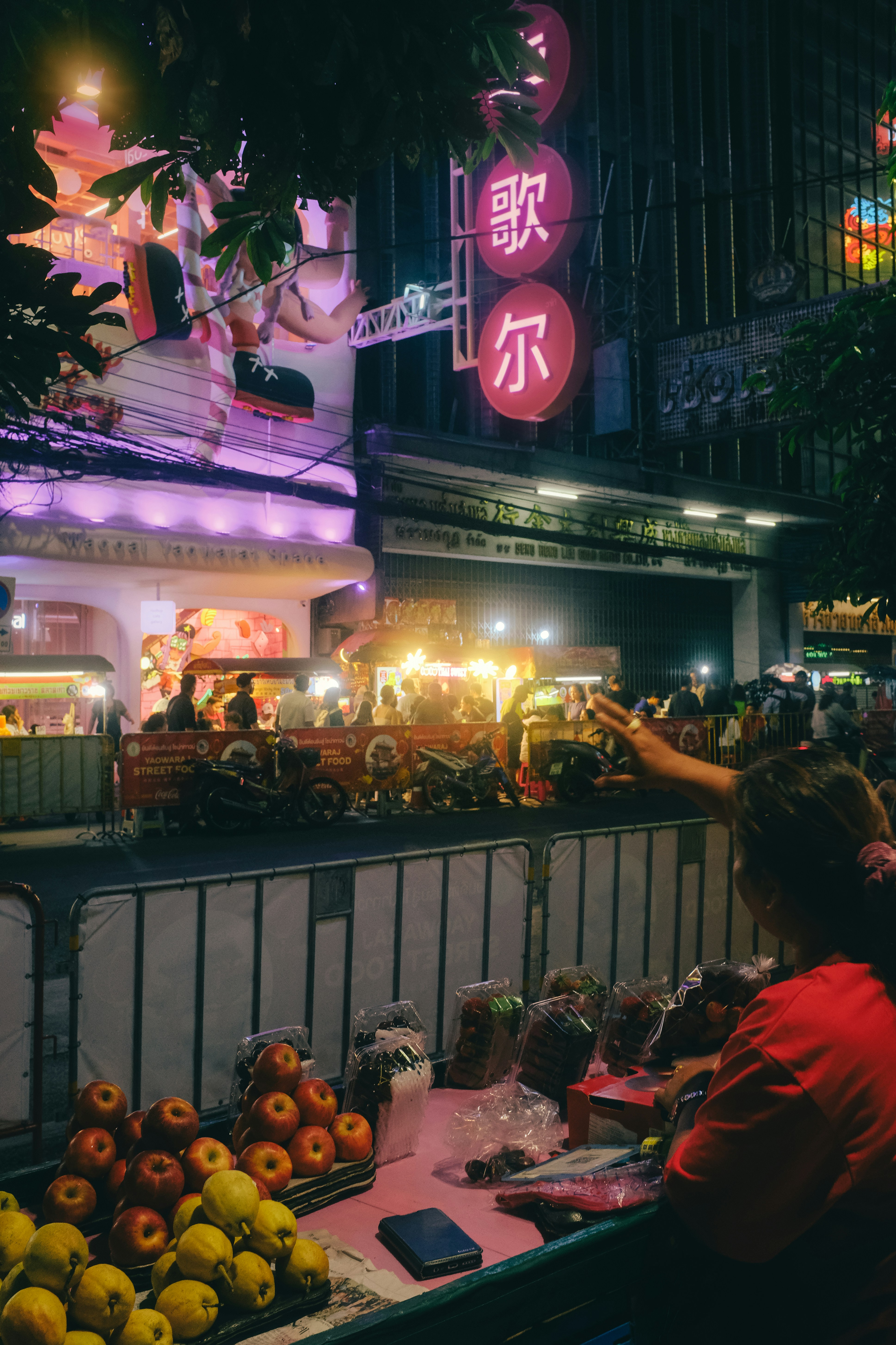 Neon Orchard Night: A Street Market Portrait Framed by Purple Neon