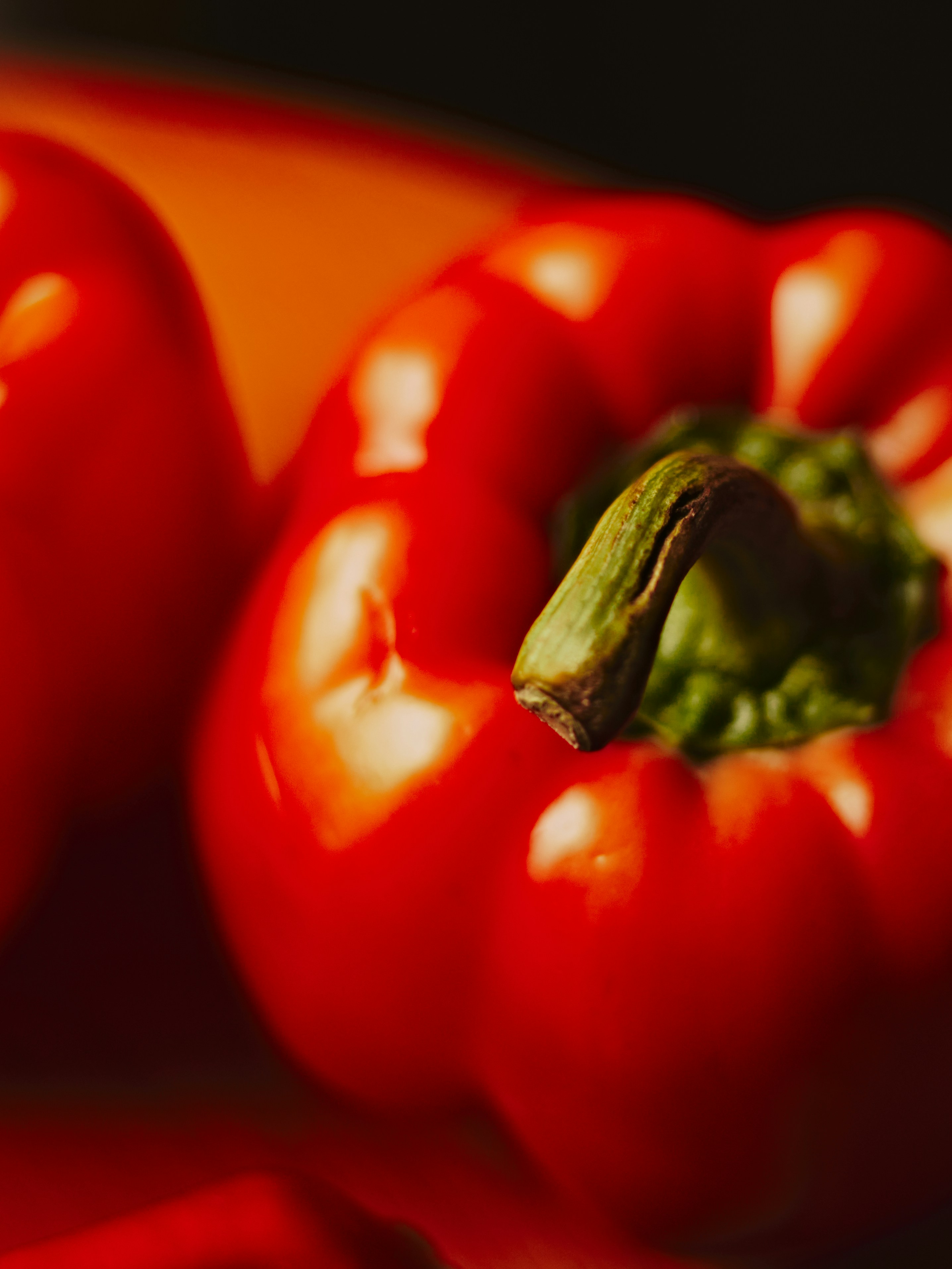 A close up of two red peppers on a plate photo – Free Cairo Image on ...