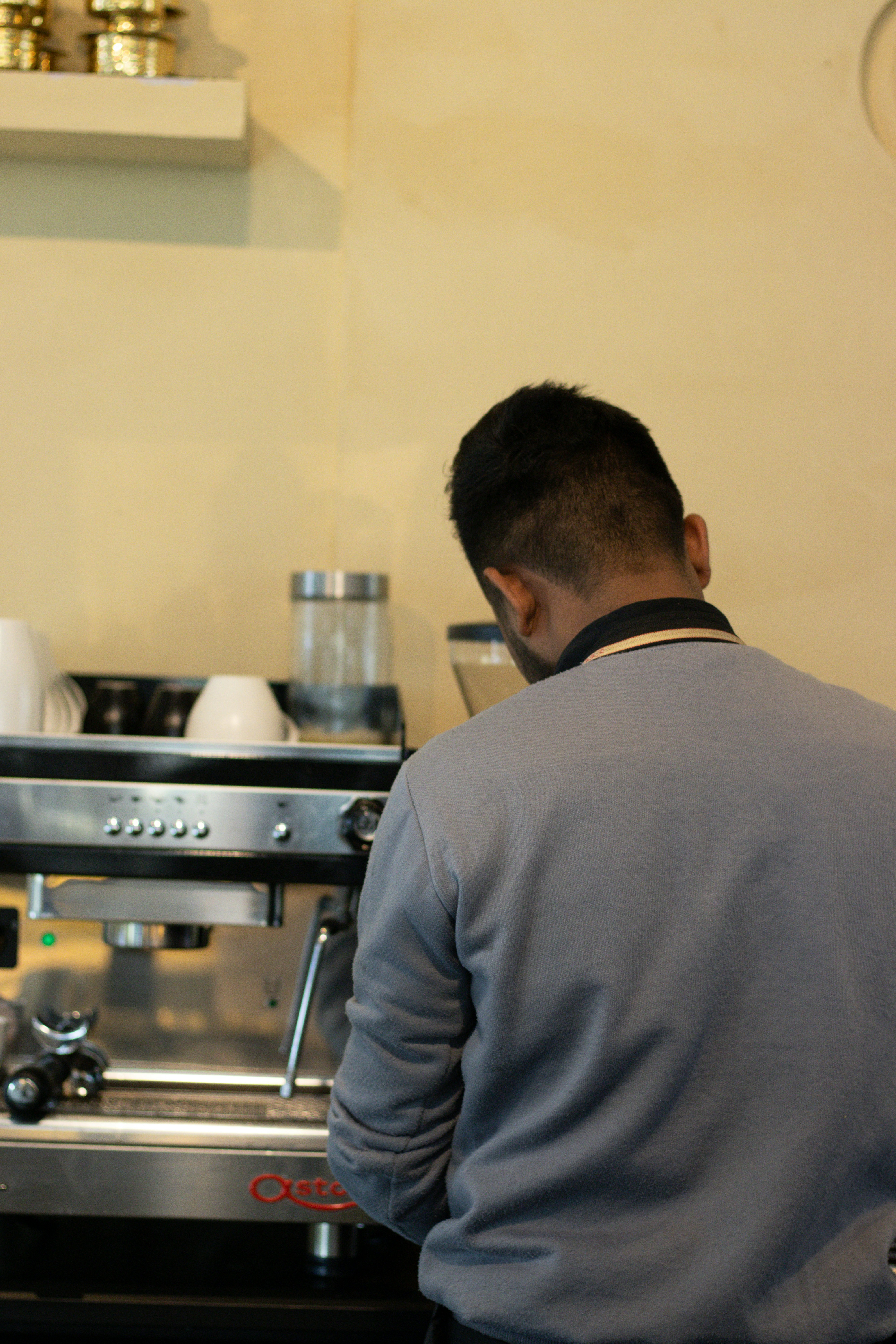 Back to the Espresso Bar: Barista at Work in a Quiet Café Corner
