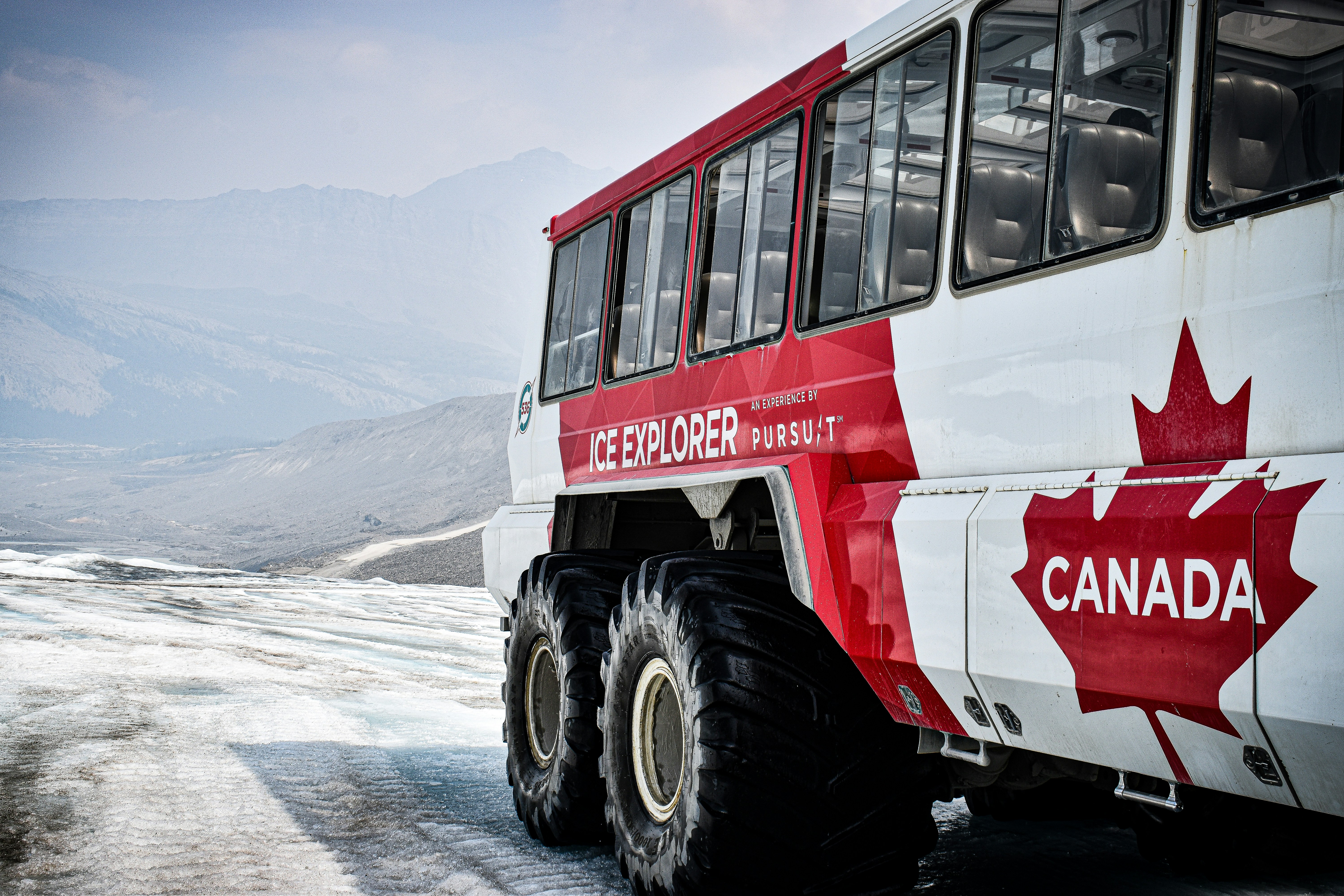 A bus with a canadian flag painted on the side of it photo – Free Bus ...