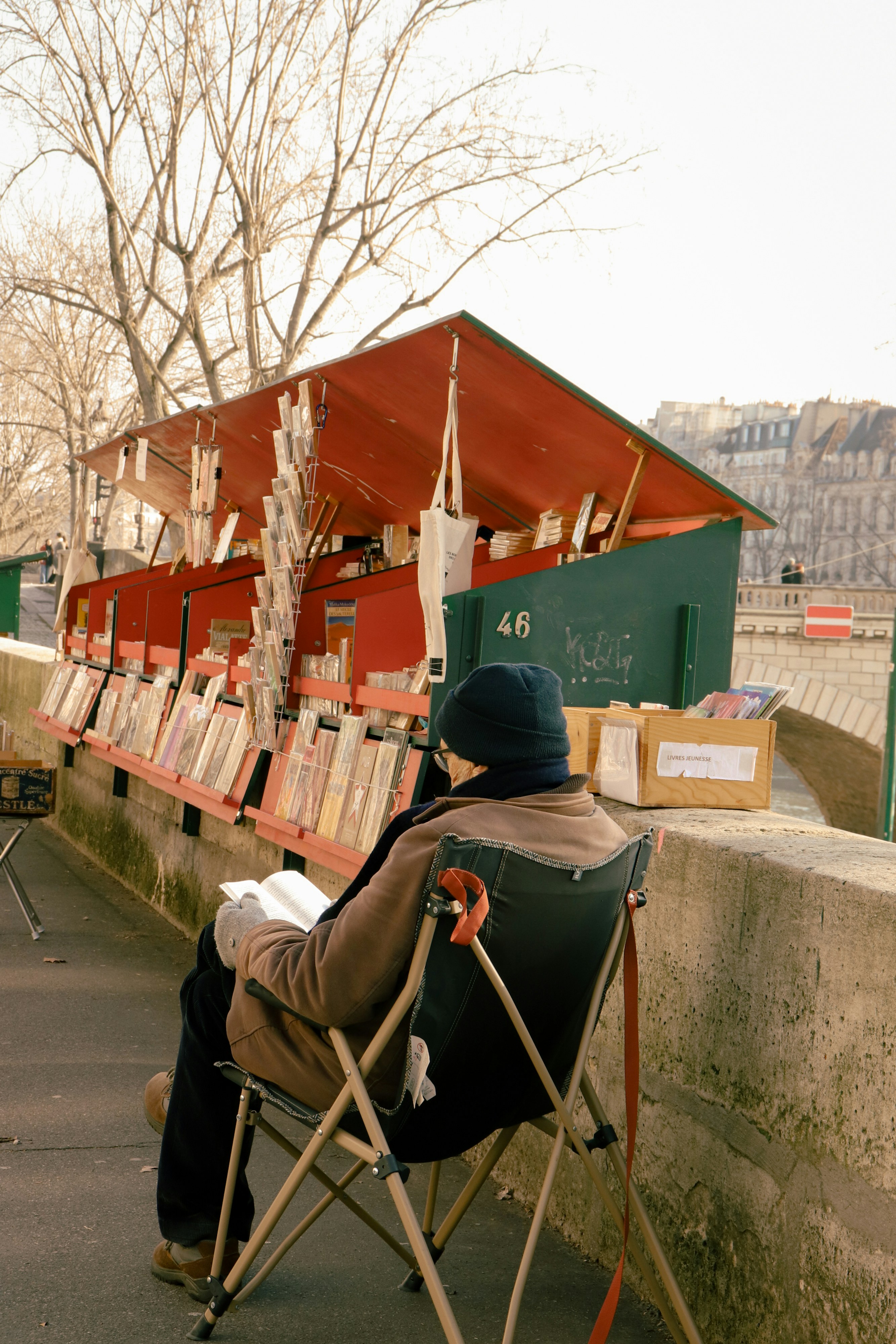 Riverside Reading: A Quiet Moment at the Book Stall