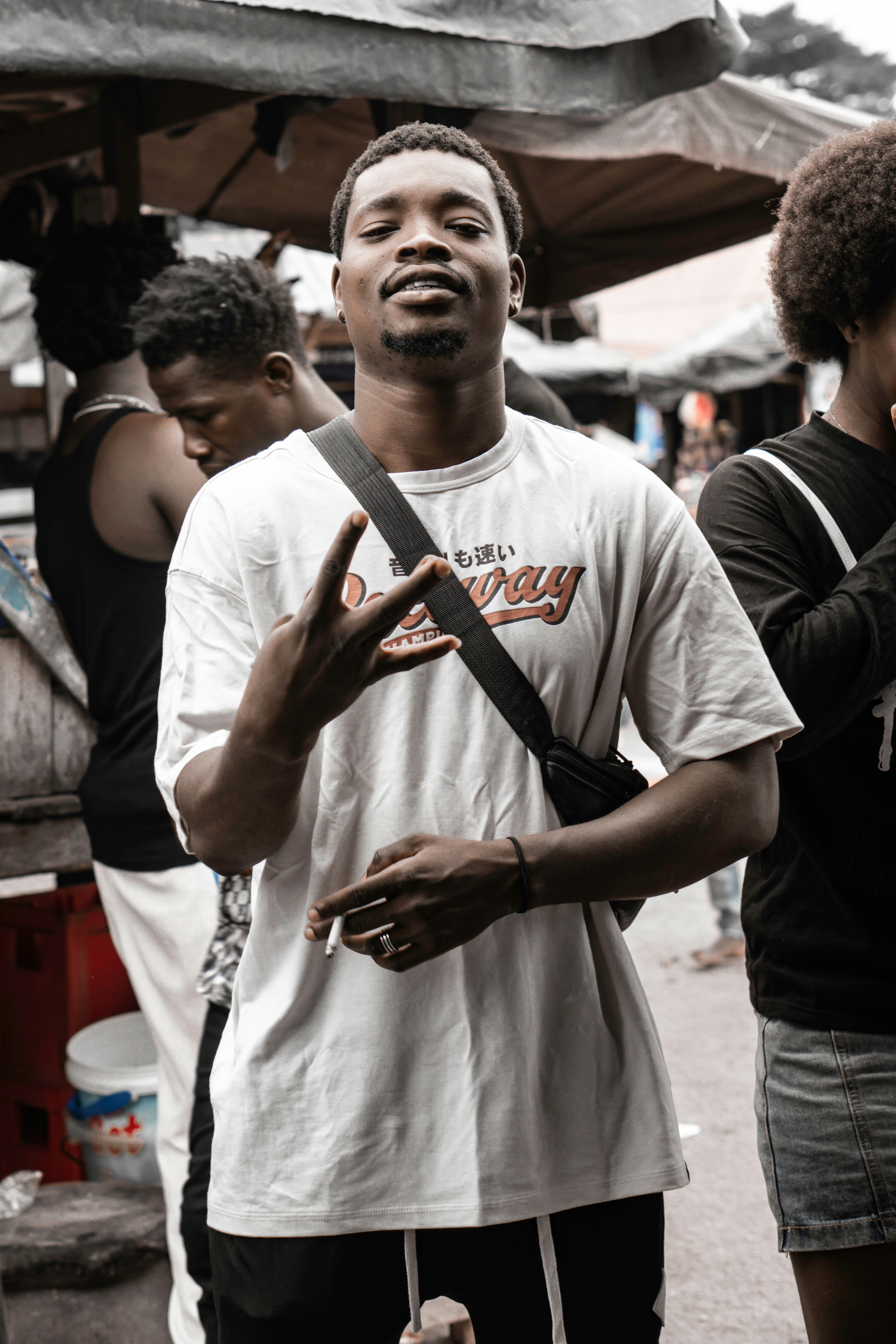 A group of young men standing around each other photo – Free T-shirt ...