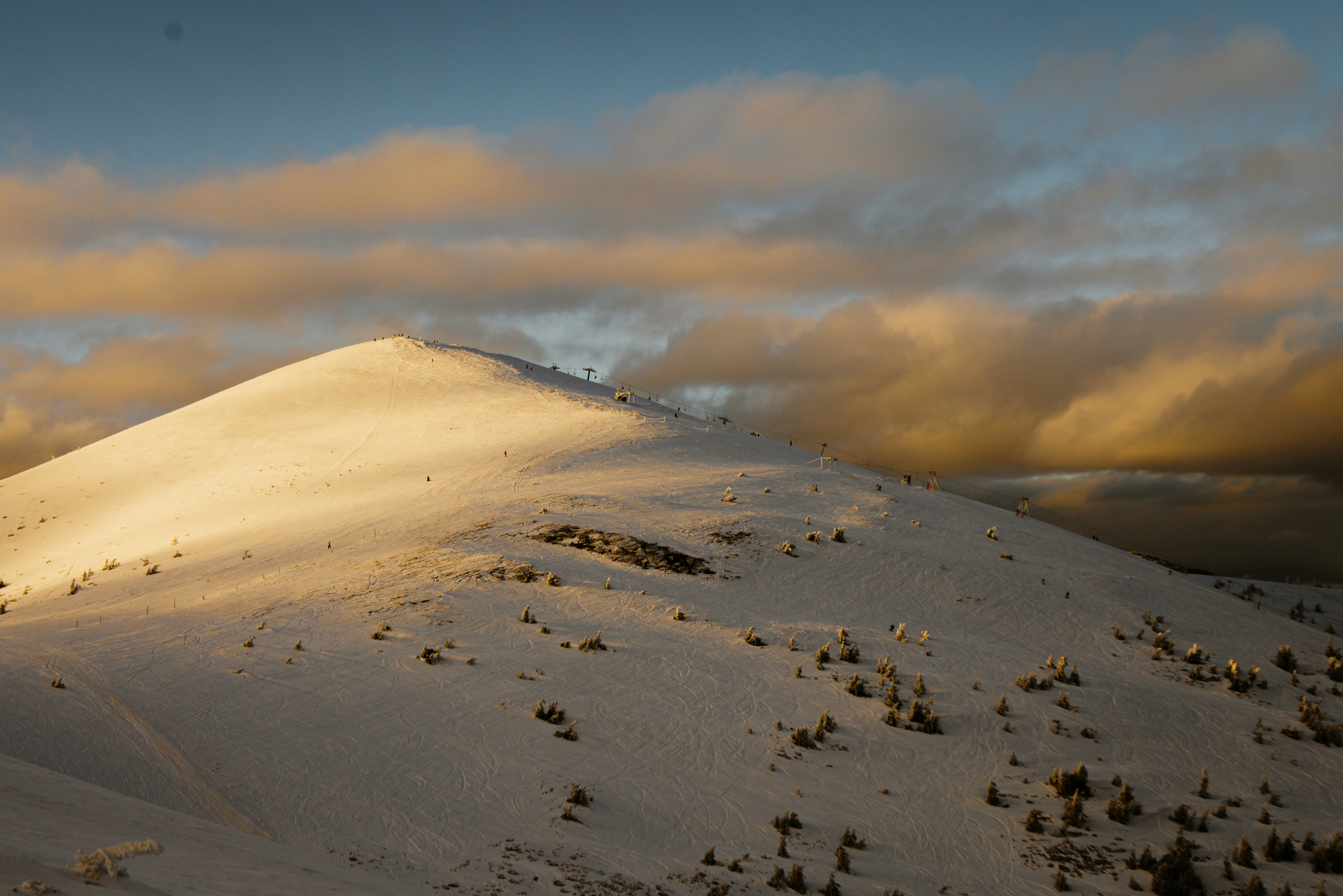 Golden Hour on the Snow-Capped Ridge