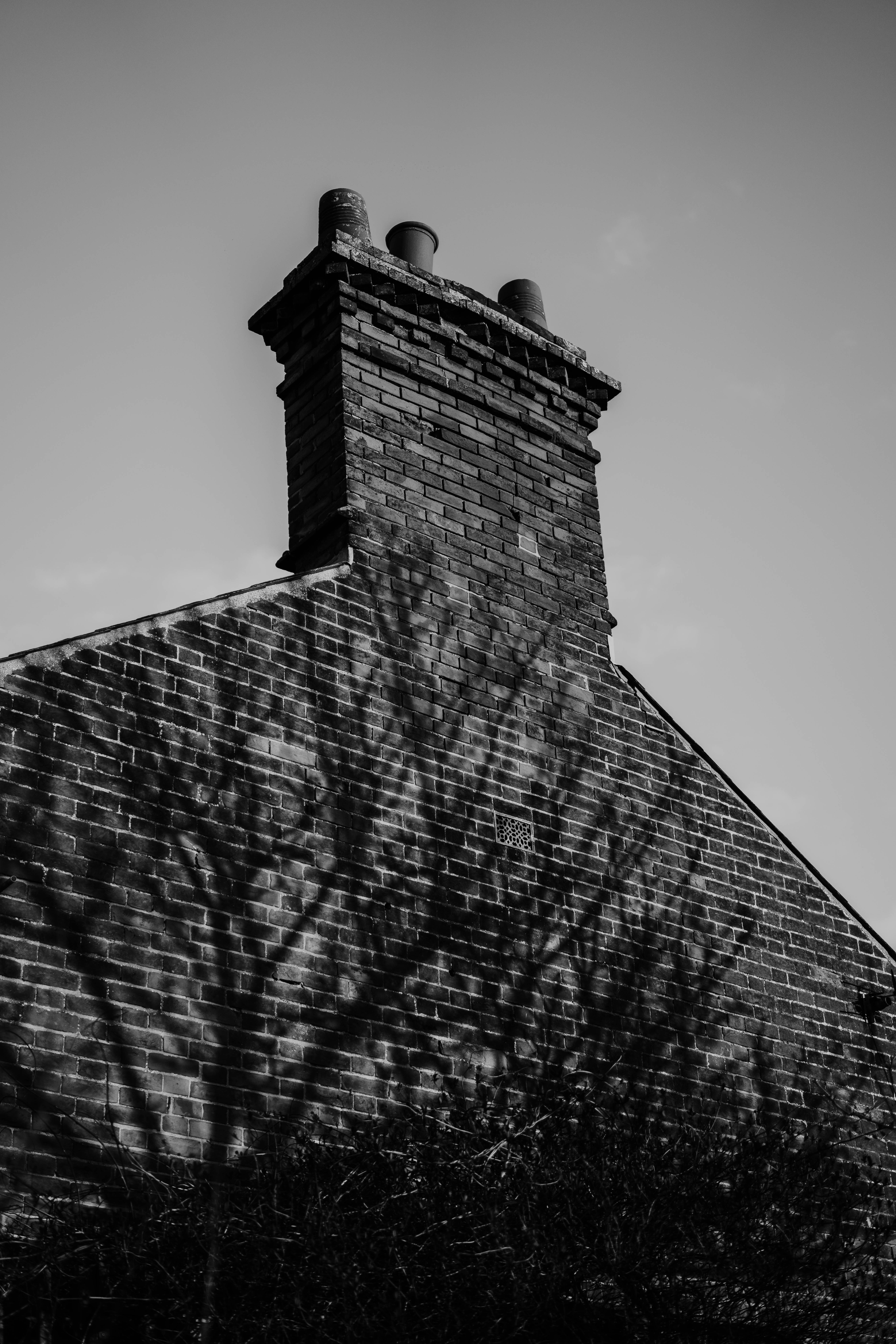 A black and white photo of a brick building photo – Free Brick Image on ...