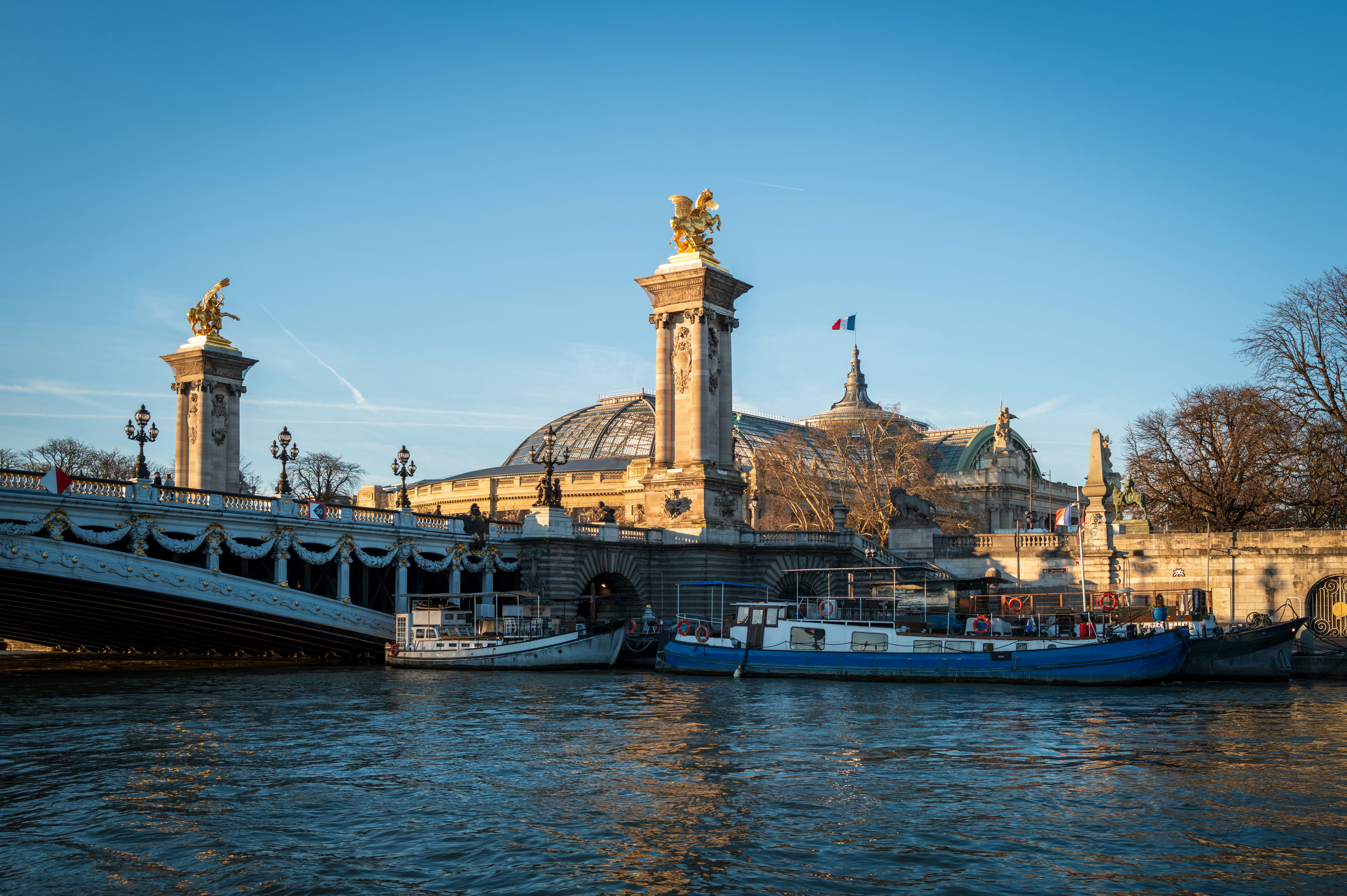 Sunlit Grand Banks and Sculpture-topped Bridge at Dusk
