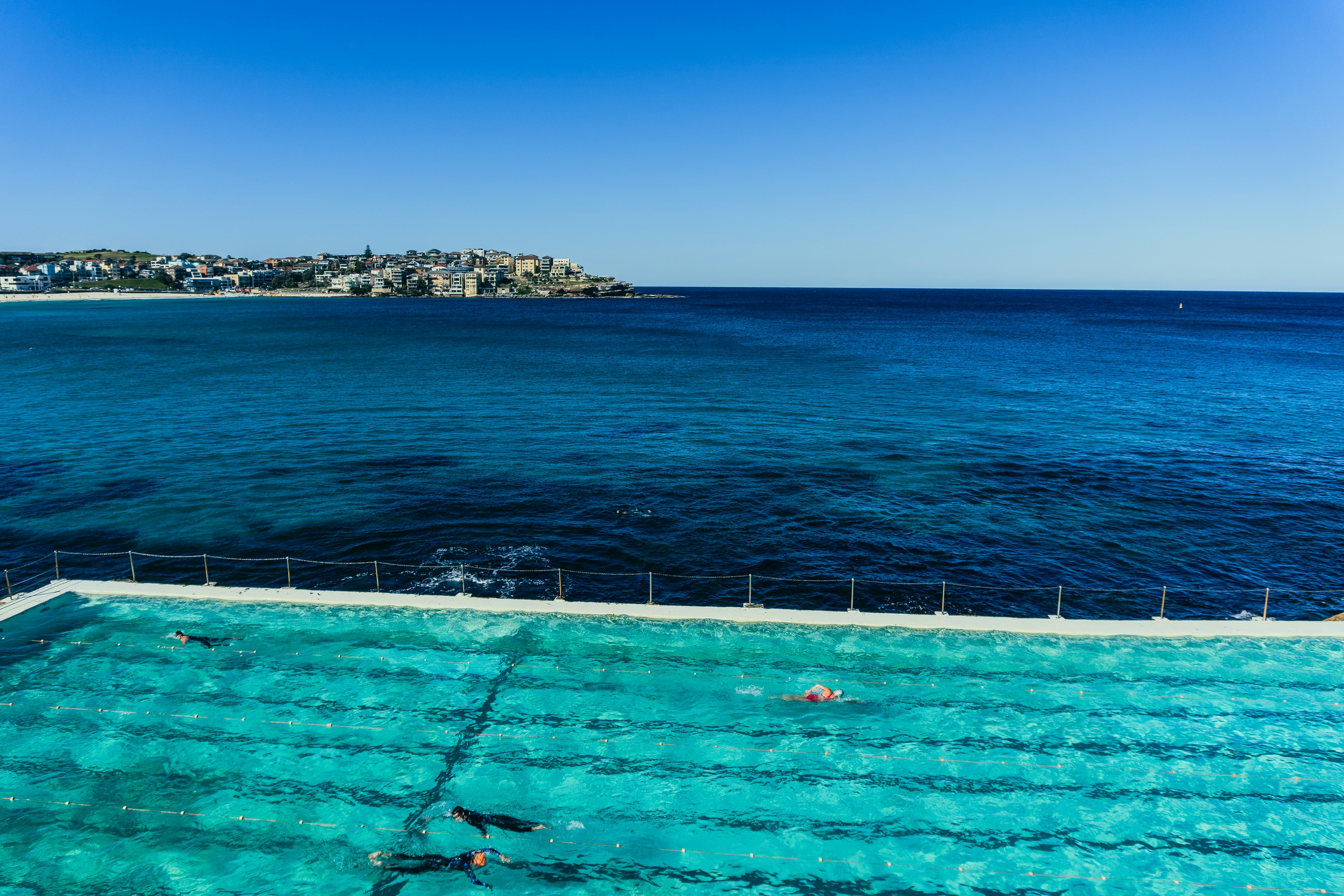 Turquoise Edge: A Sunlit Pool Framing the Azure Atlantic