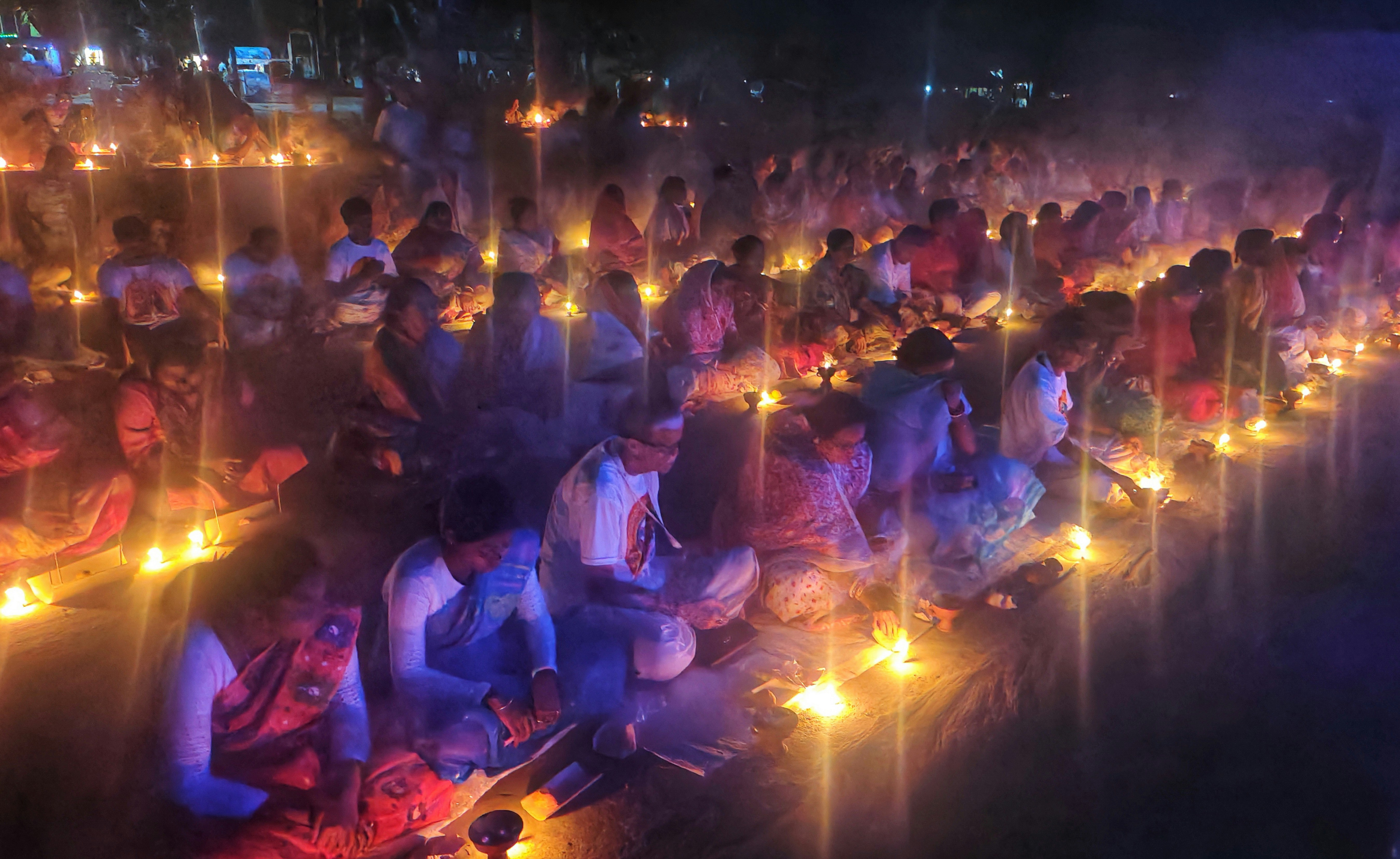 Candlelit Vigil: Rows of Flame and Quiet Faces in the Night