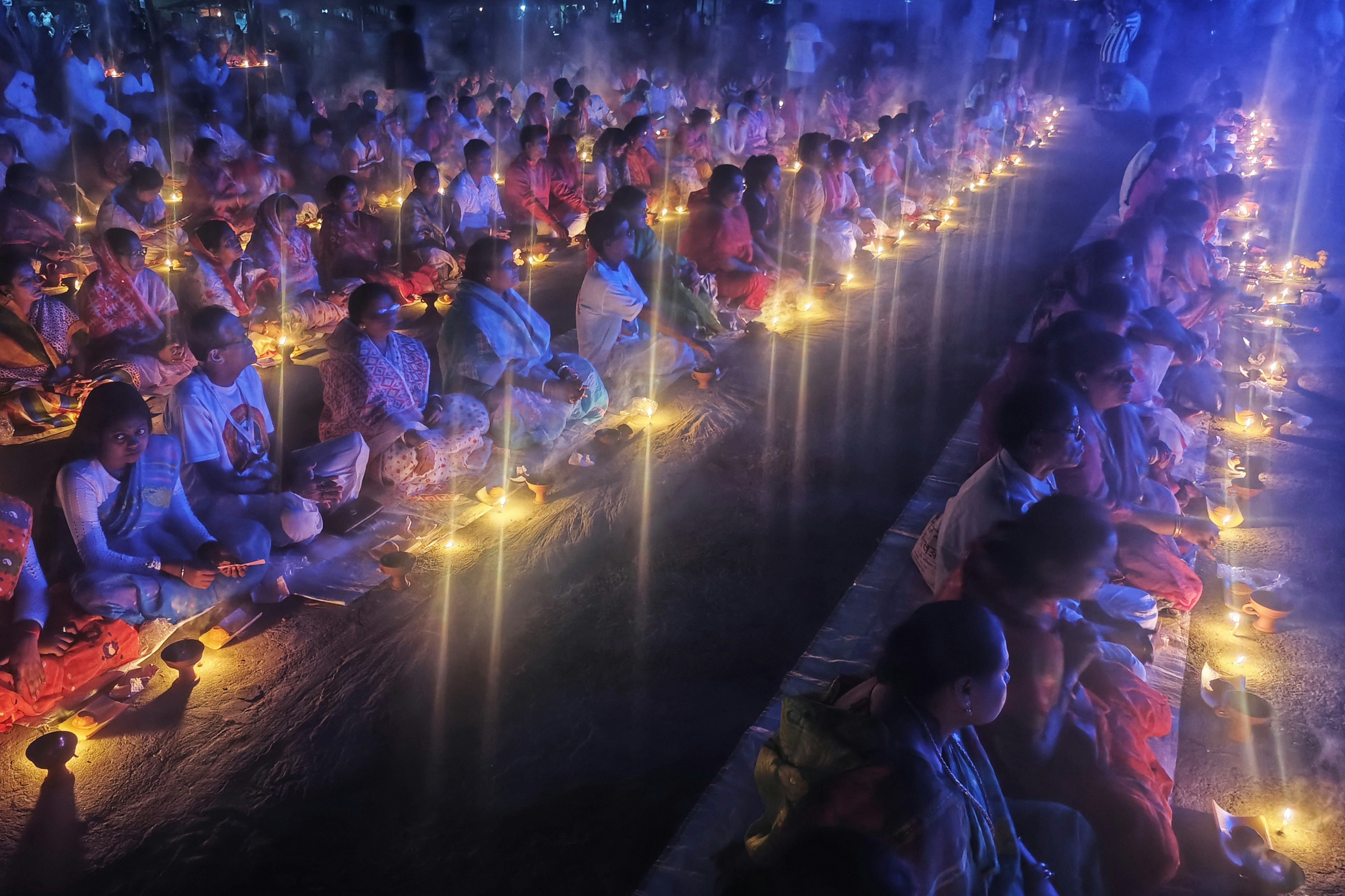 Candlelit Canal Vigil: Rows of Glow Along the Water
