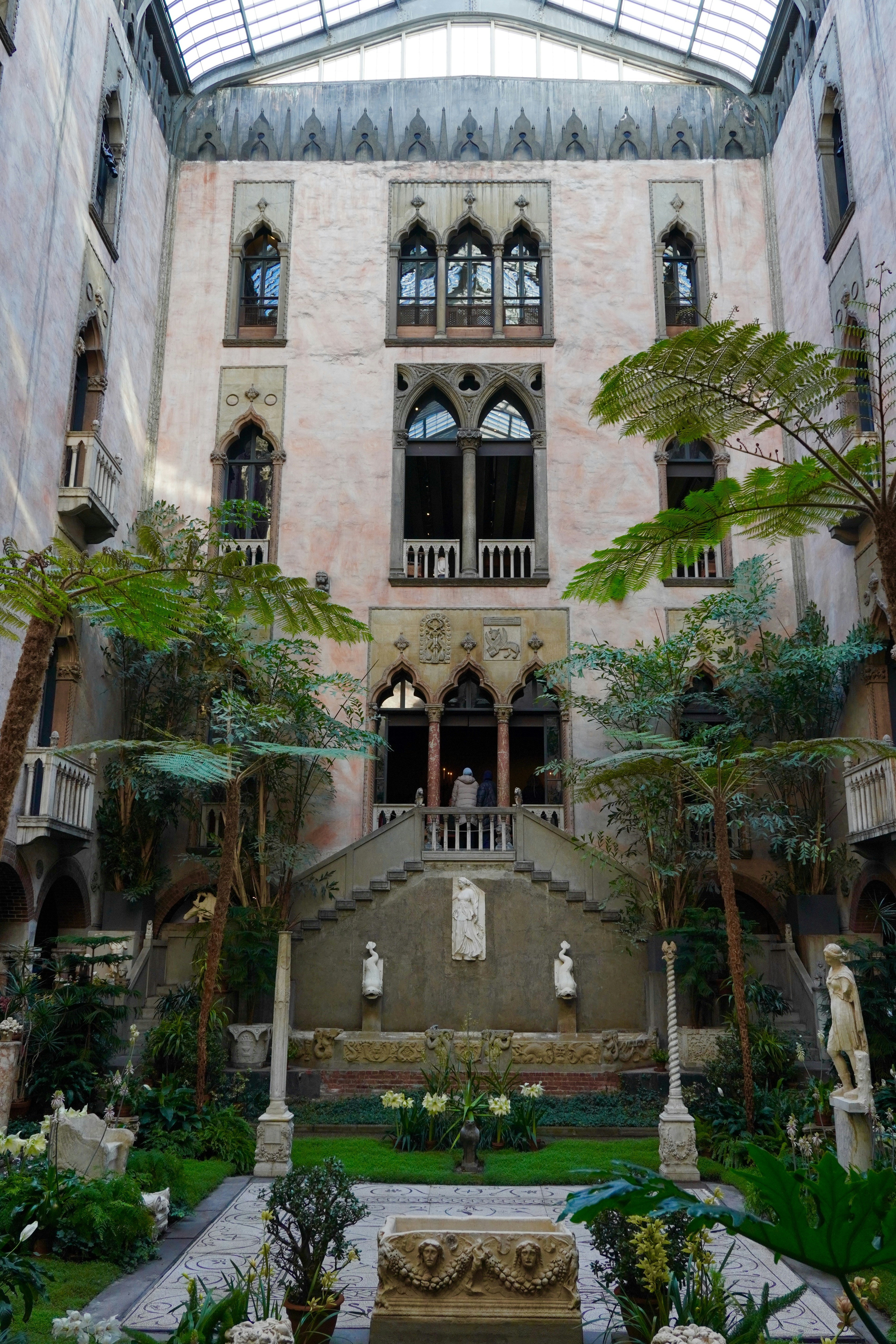 Arched Balcony Vista: Central Staircase in a Sunlit Gothic Atrium