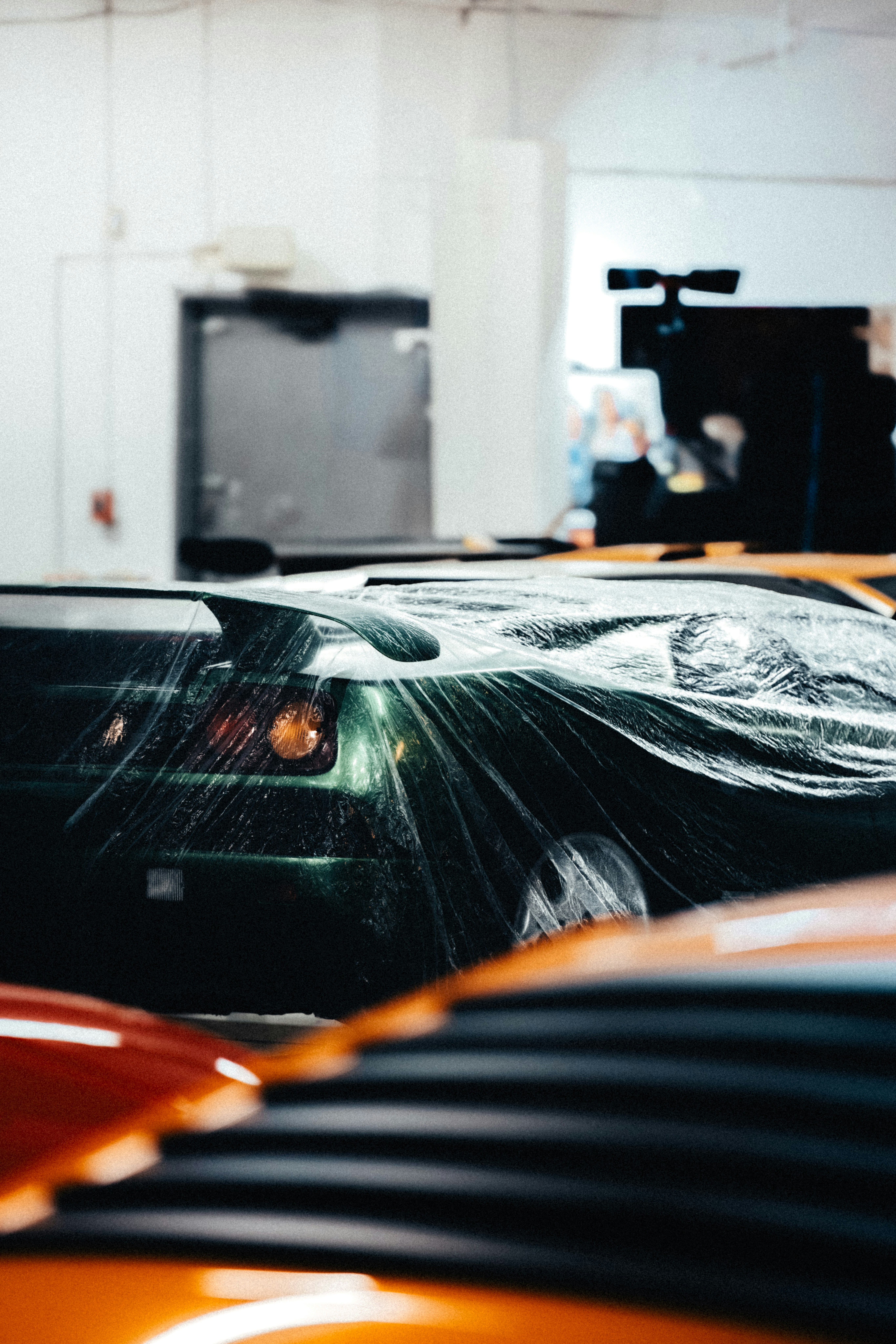 A bunch of cars parked in a garage photo – Free Car Image on Unsplash