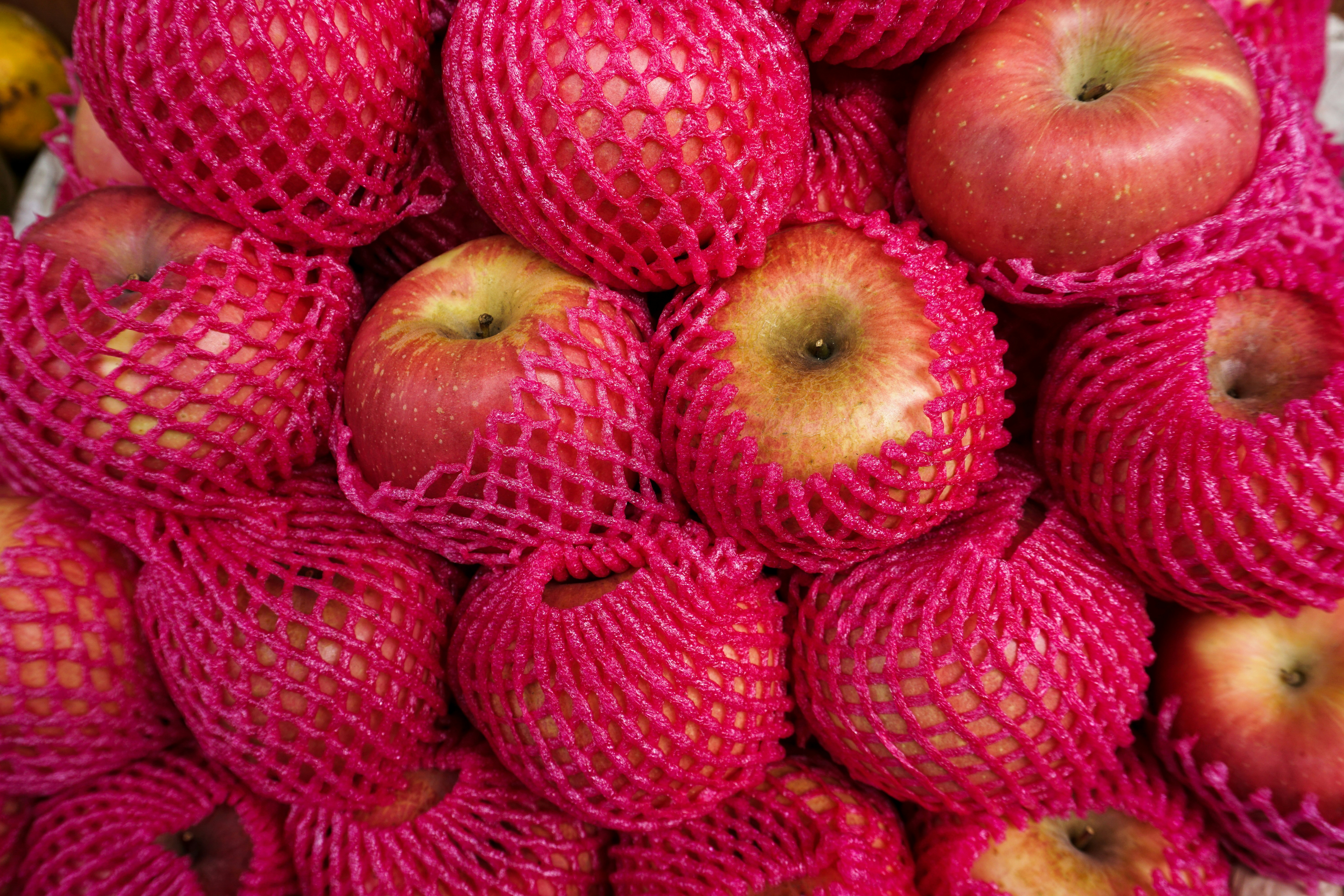 Crimson Comfort: Apples in Vibrant Mesh