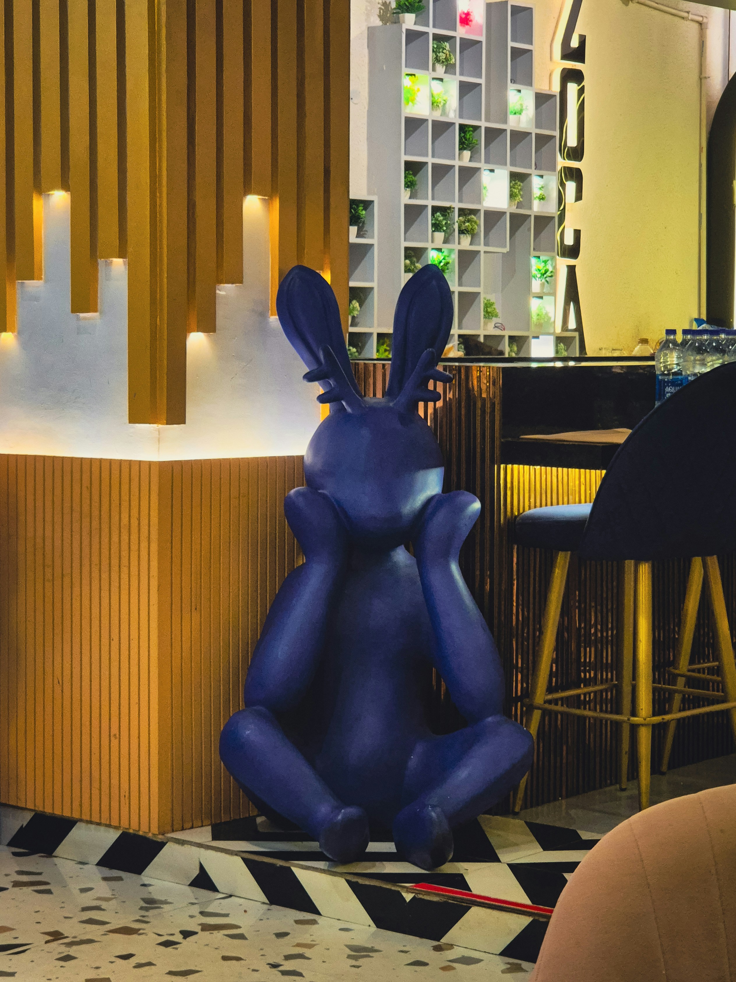 Blue Bunny at the Bar: A Sculpted Silhouette in Neon Night