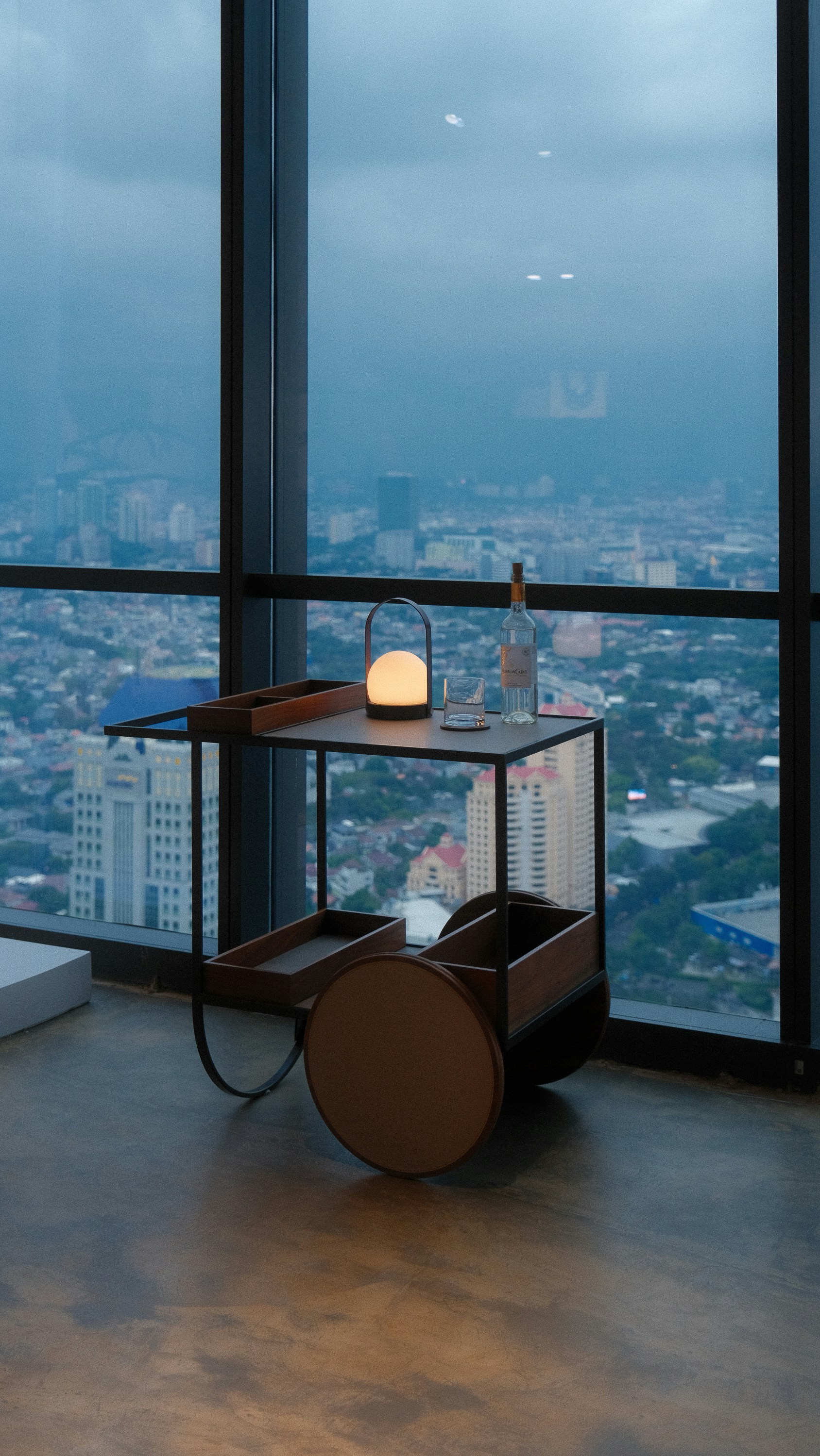 Evening Glow on a Minimalist Bar Cart Against the City Horizon