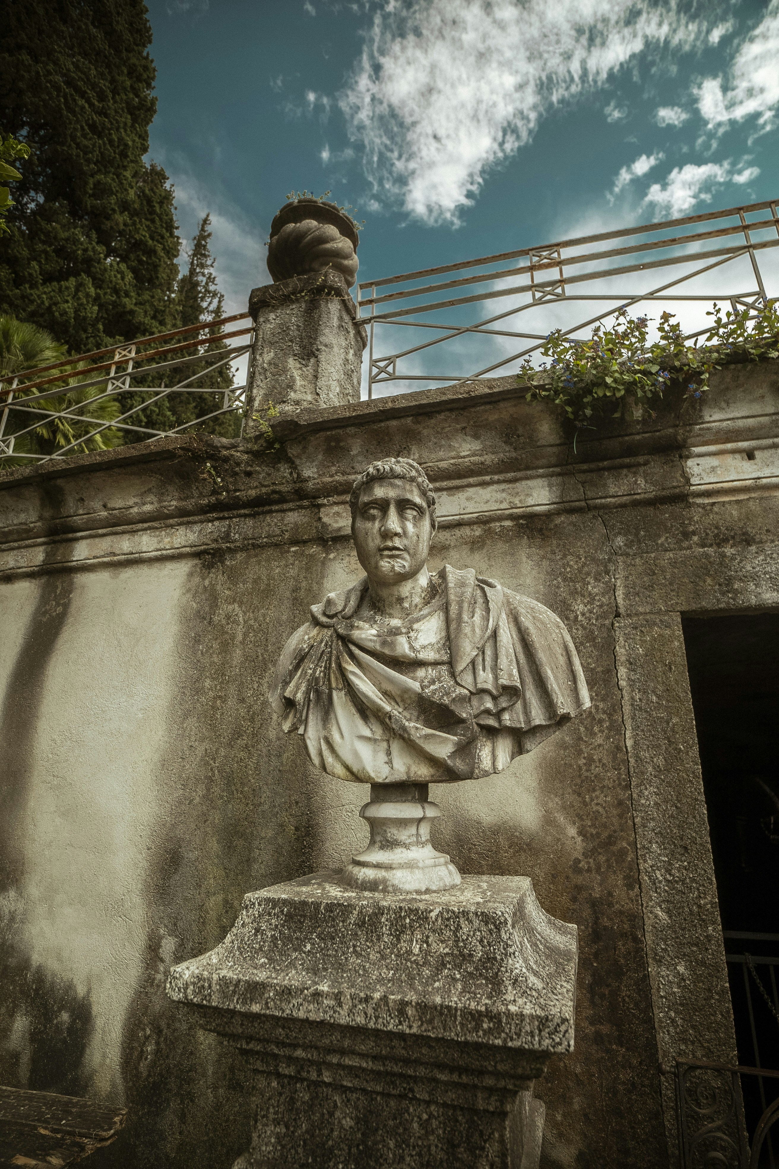 Timeworn Bust Under a Cerulean Sky