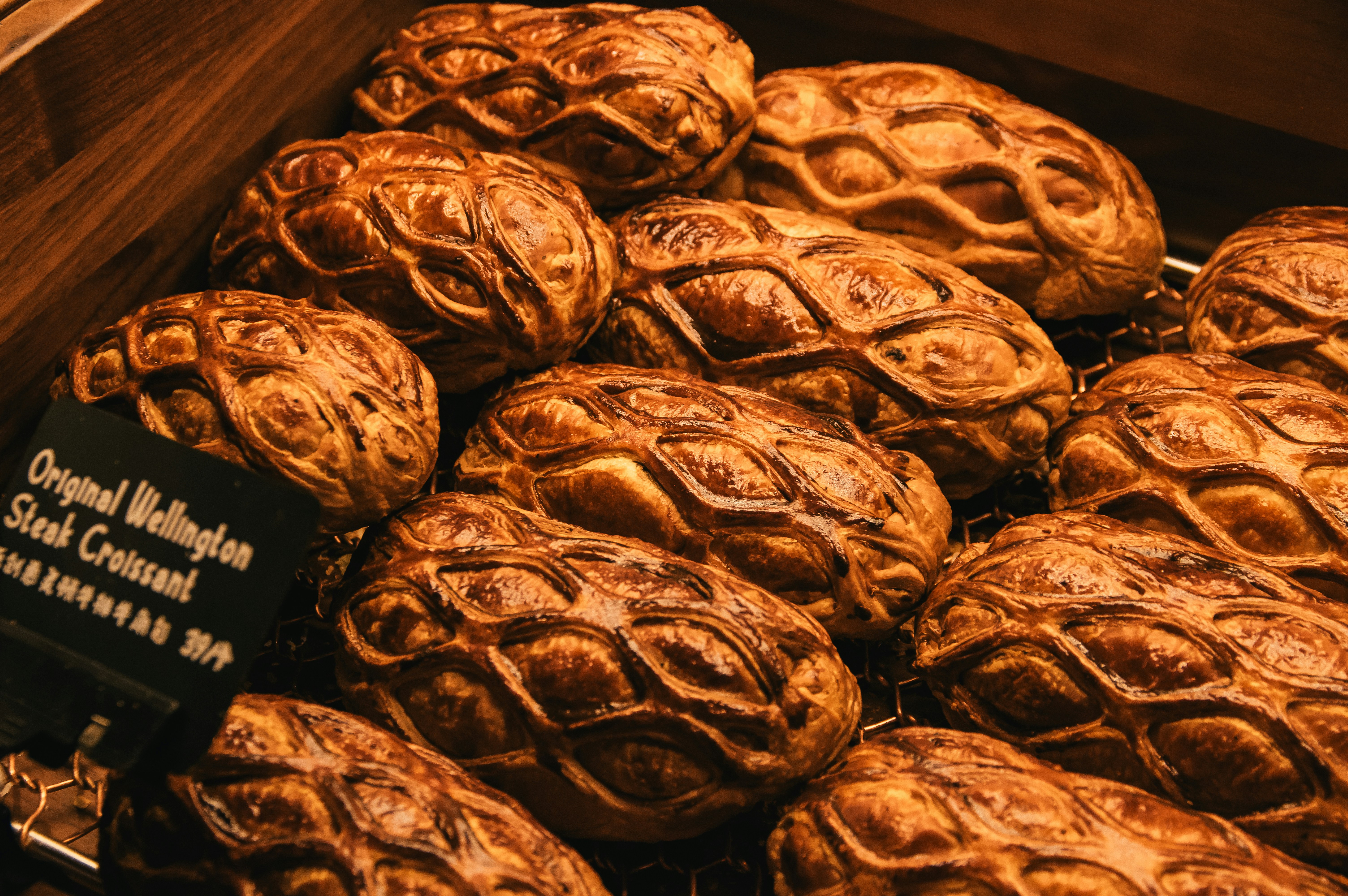 Amber-crusted artisan loaves glow in a cozy bakery display