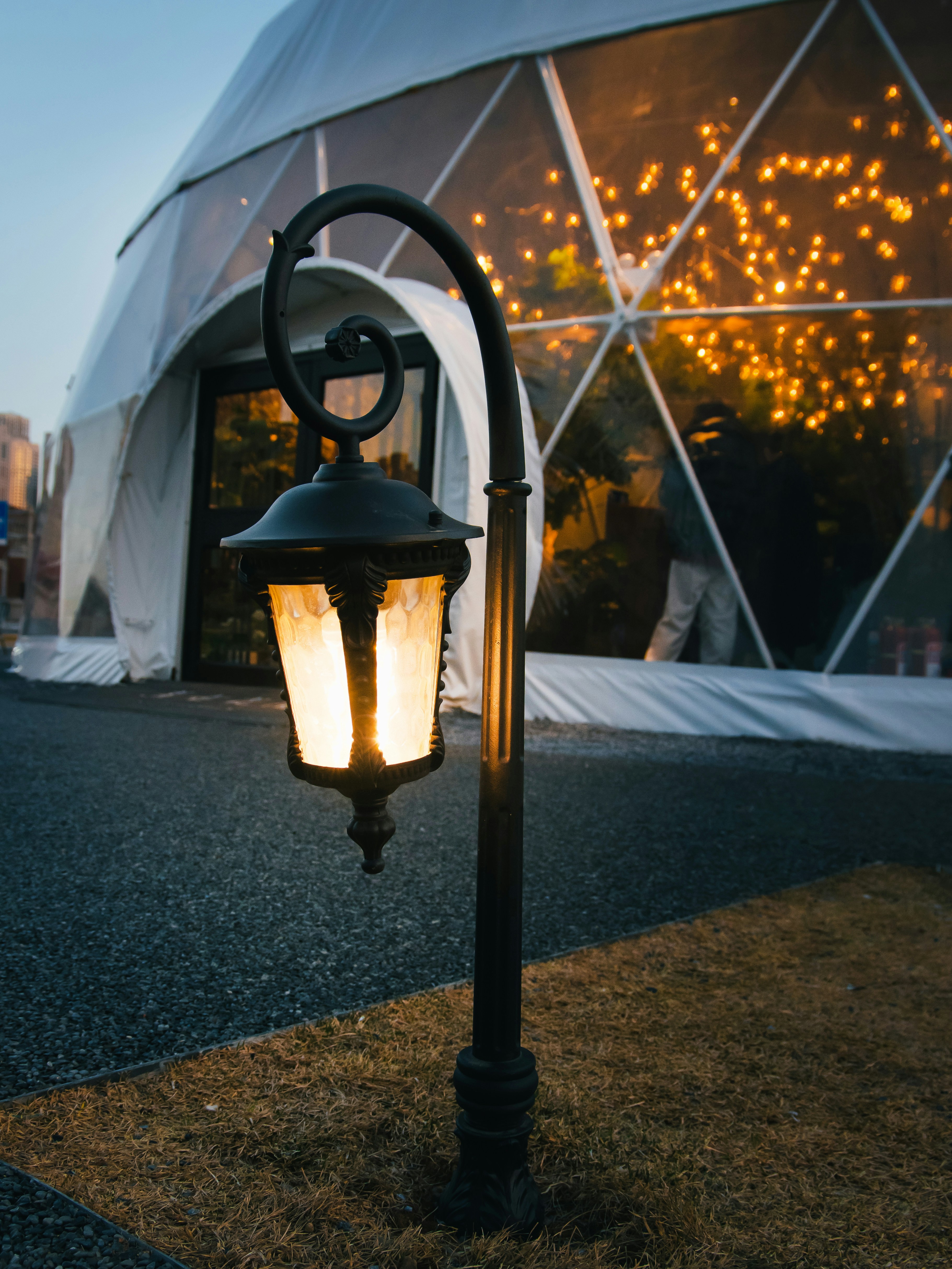 Gaslight at the Dome: A Lantern Framed by Geodesic Reflections