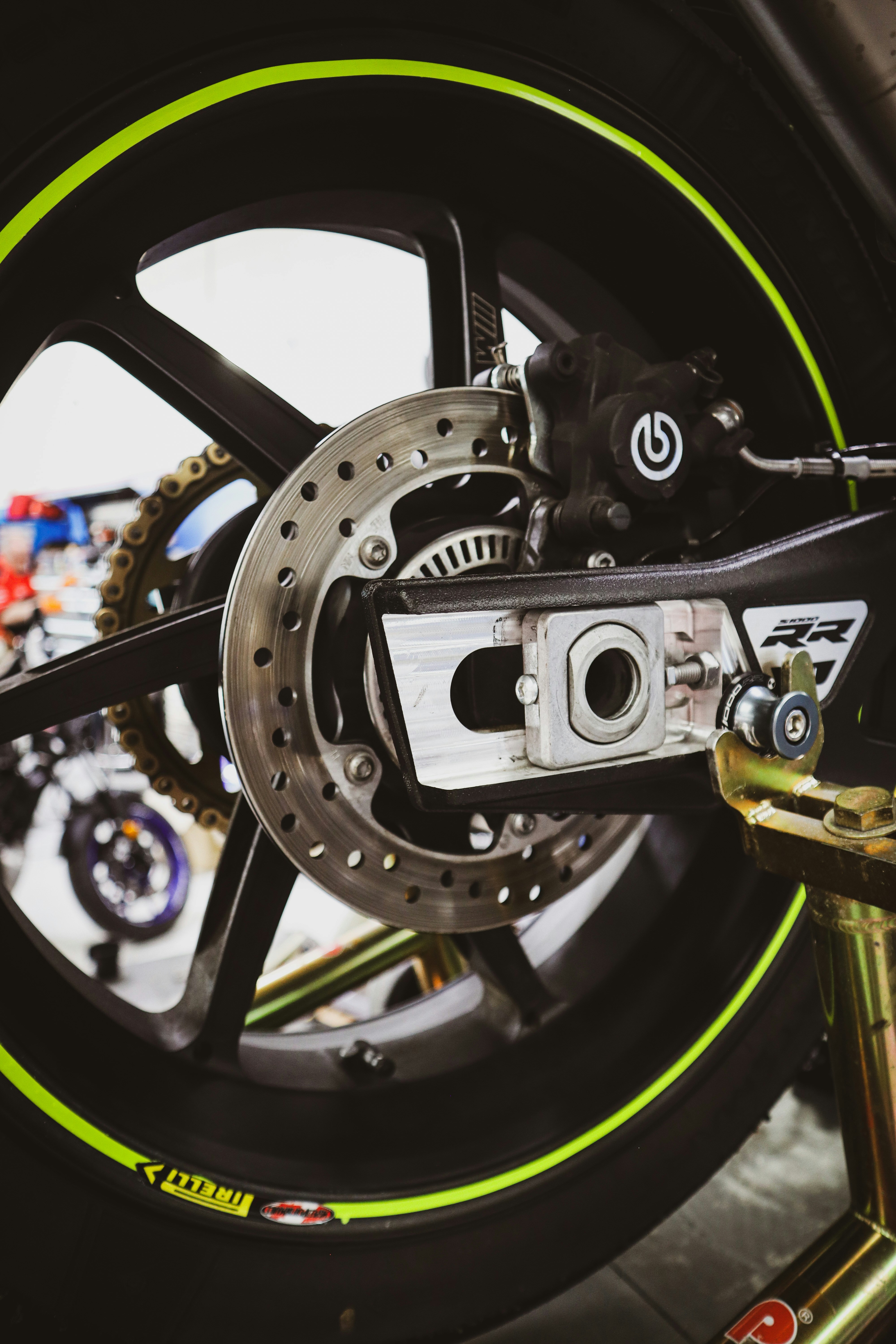 Neon Rim and Vented Braking: A Close-Up of a Sportbike Wheel